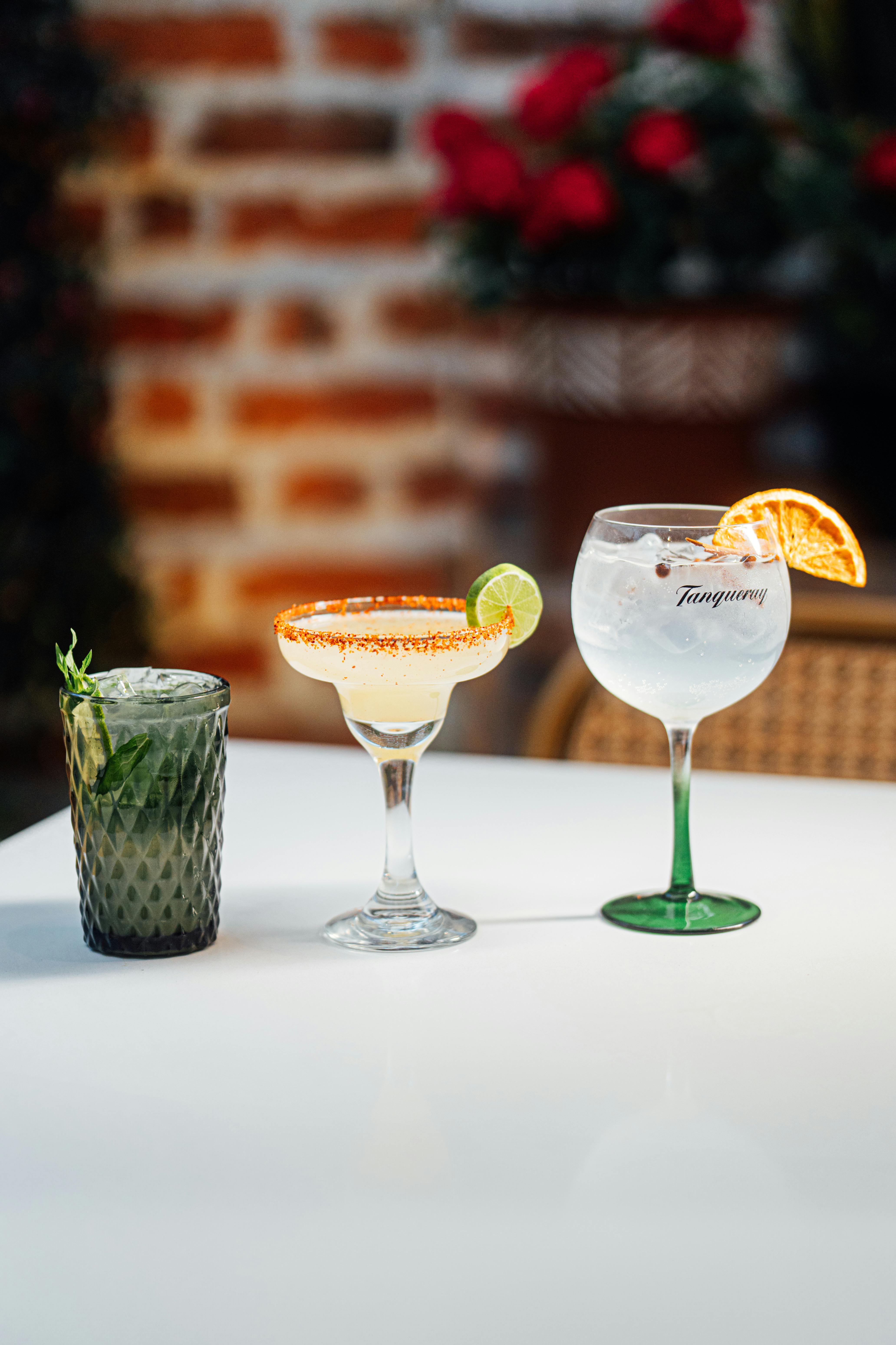 Elegant Cocktail Trio on a Patio Table · Free Stock Photo