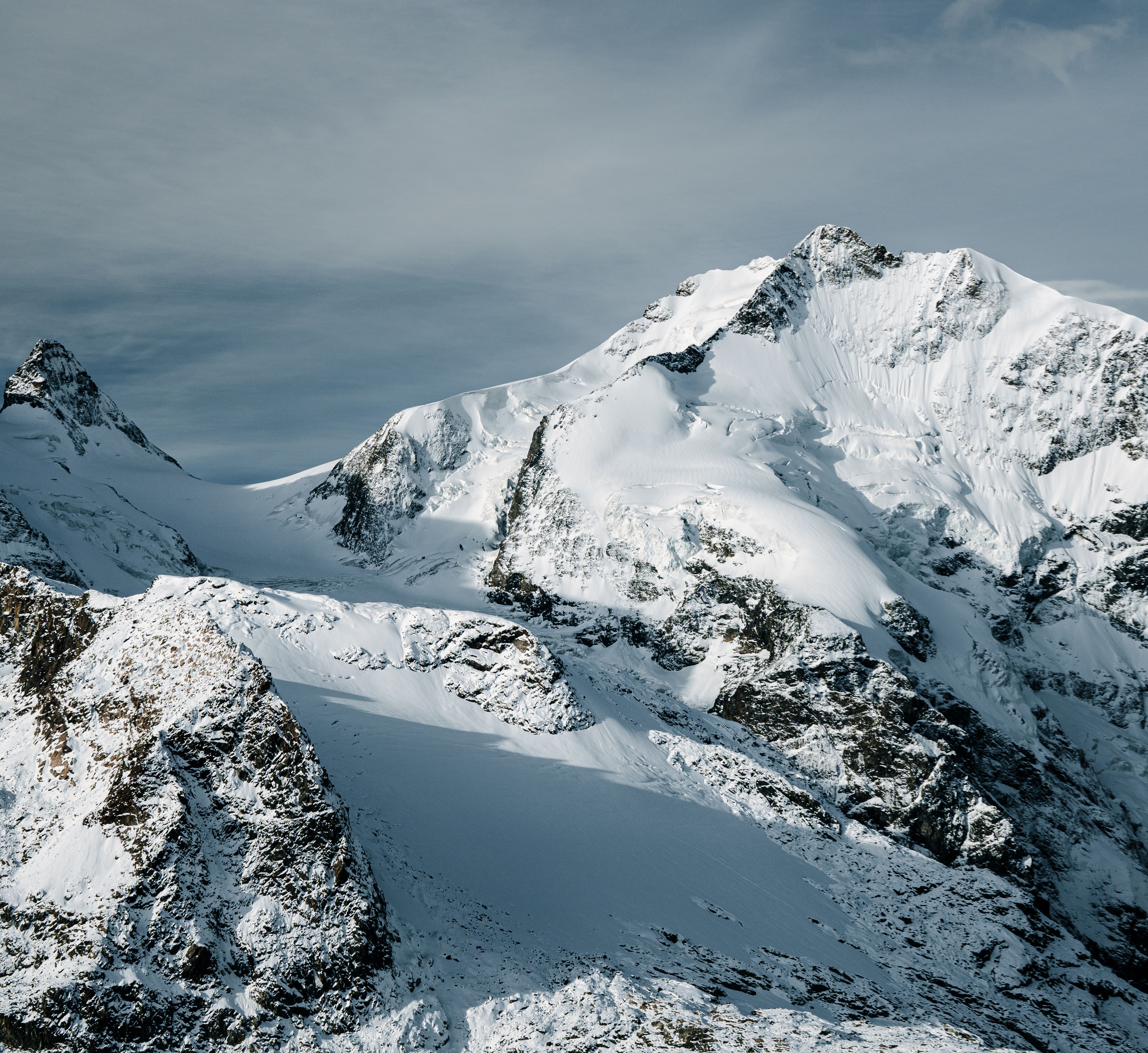 Majestic Snow-Covered Mountains in Graubünden · Free Stock Photo
