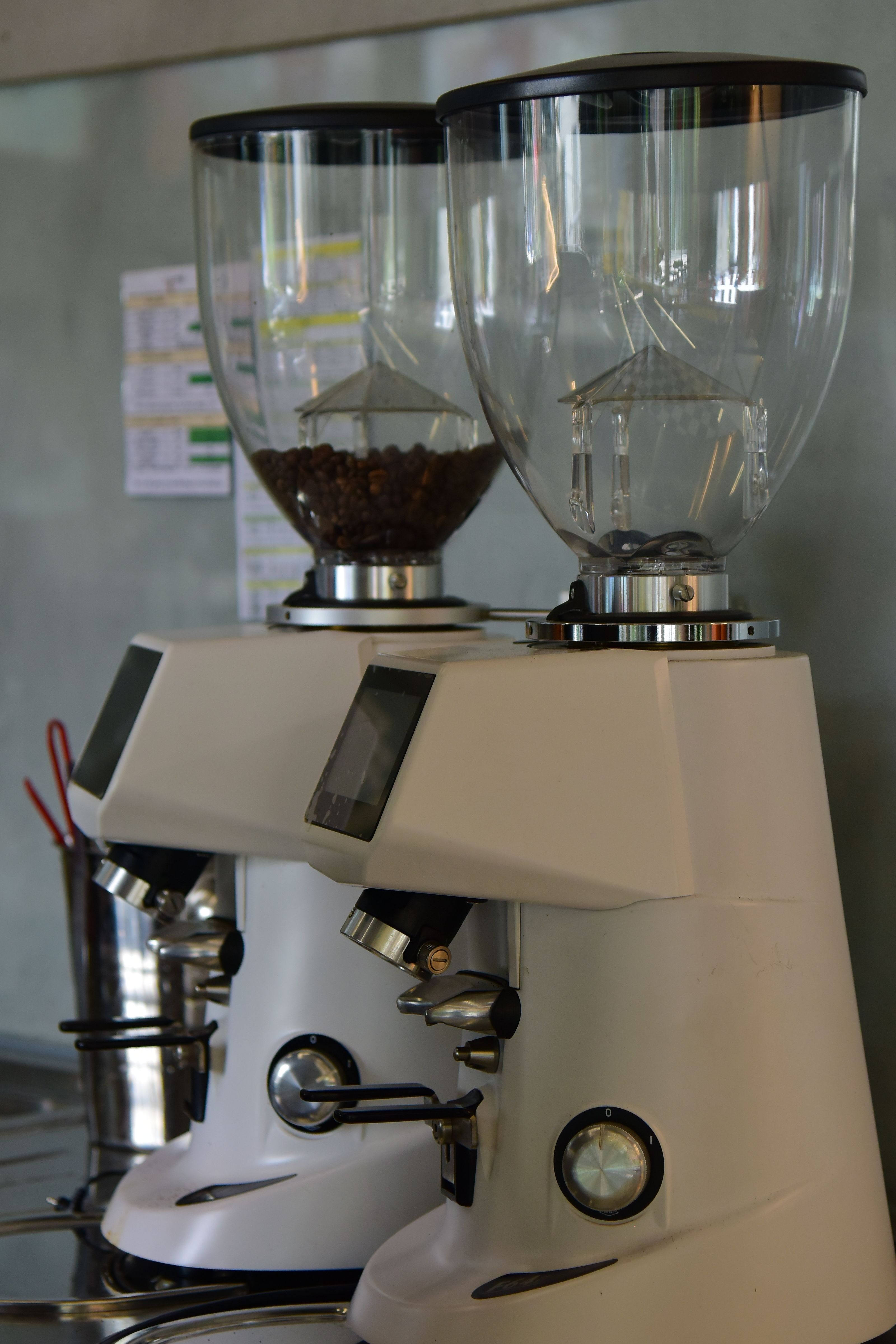 Close-up of Modern Coffee Grinders in Cafe Setting · Free Stock Photo