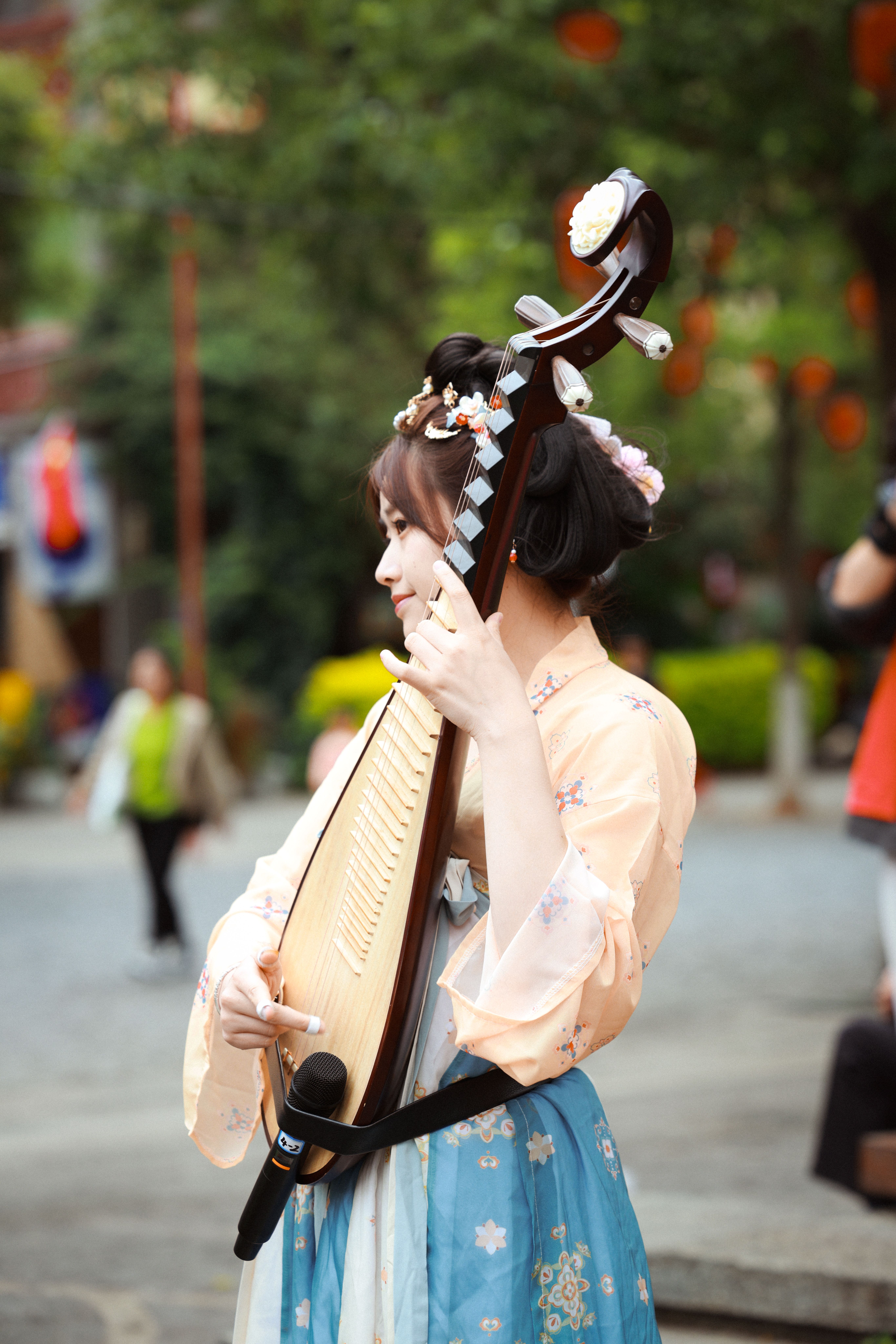 Young Woman Playing Traditional Chinese Instrument · Free Stock Photo