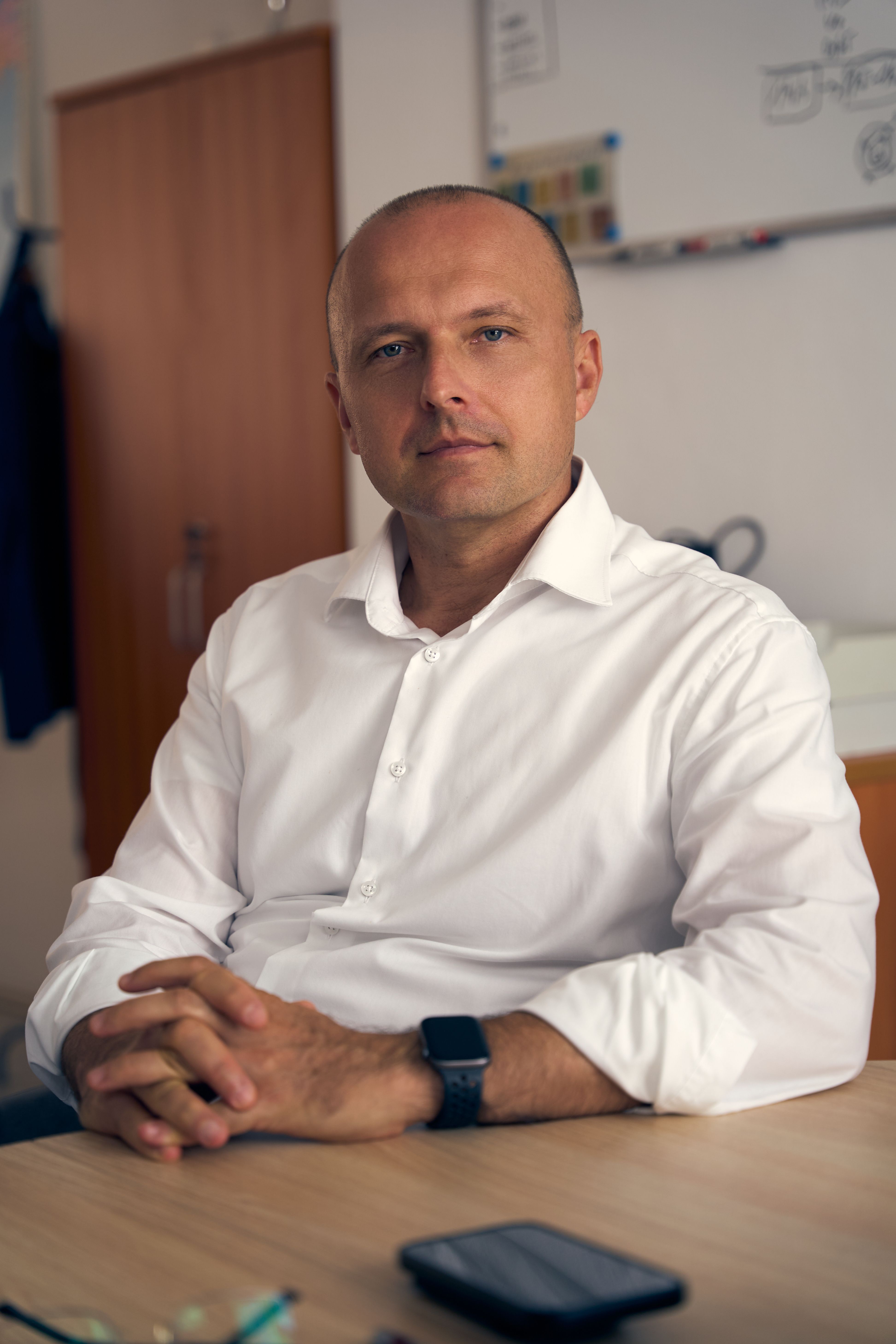 Professional Portrait in Office Setting · Free Stock Photo