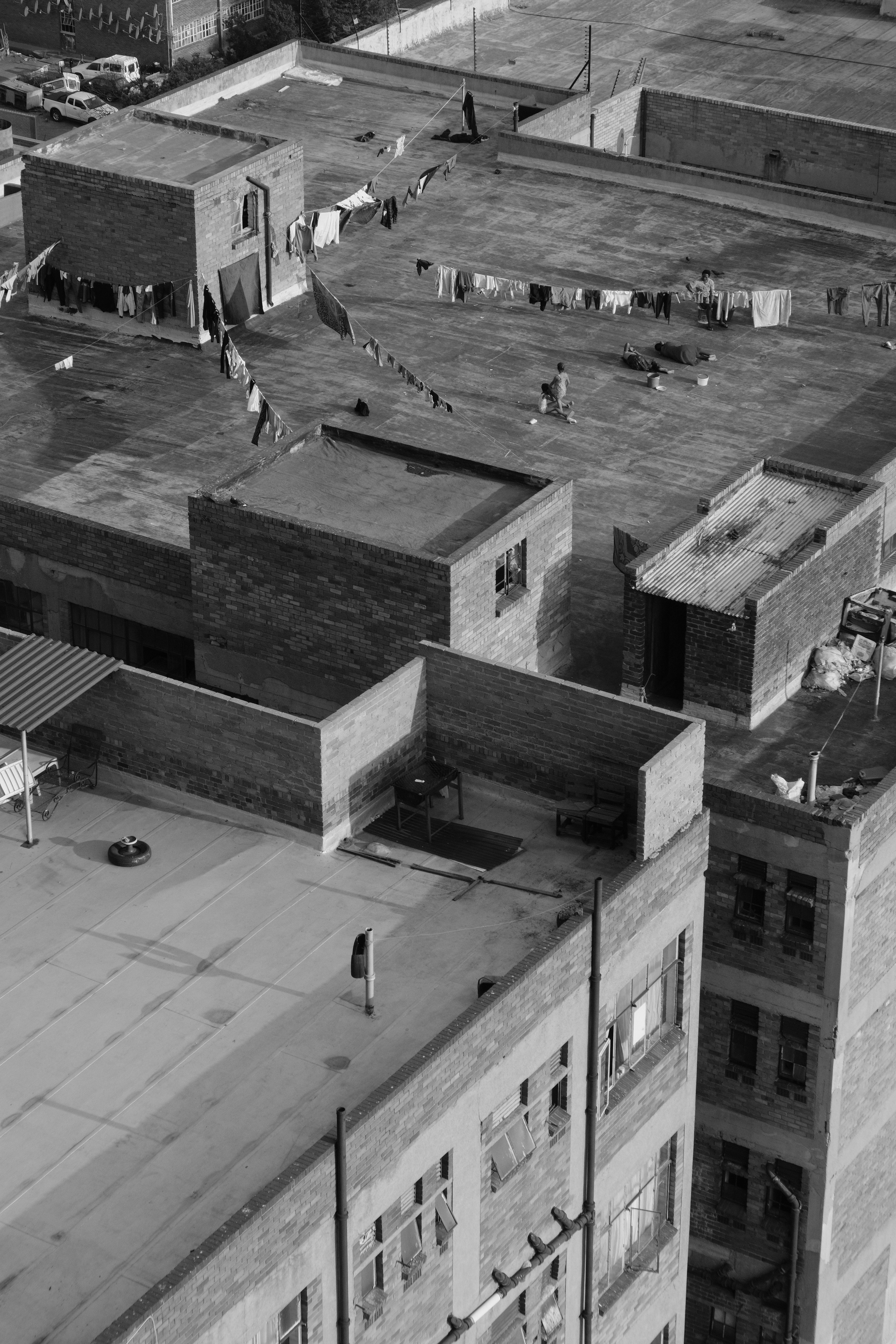 Aerial View of Urban Rooftops with Laundry Lines · Free Stock Photo