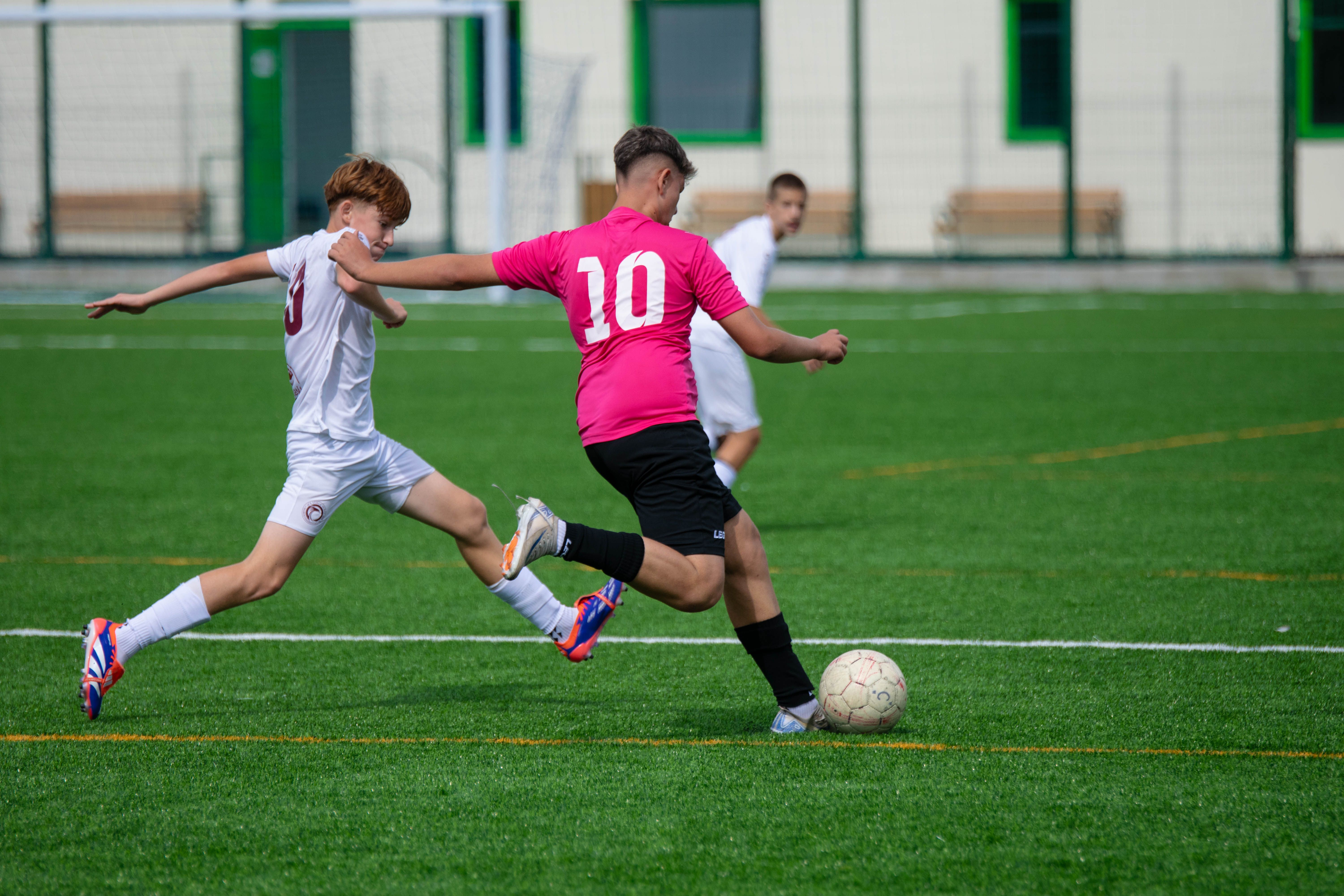 Teenage Soccer Players in Action on Field · Free Stock Photo