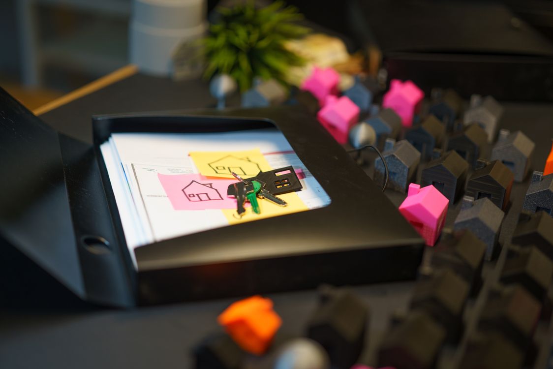 Real Estate Keys and Documents with House Models · Free Stock Photo