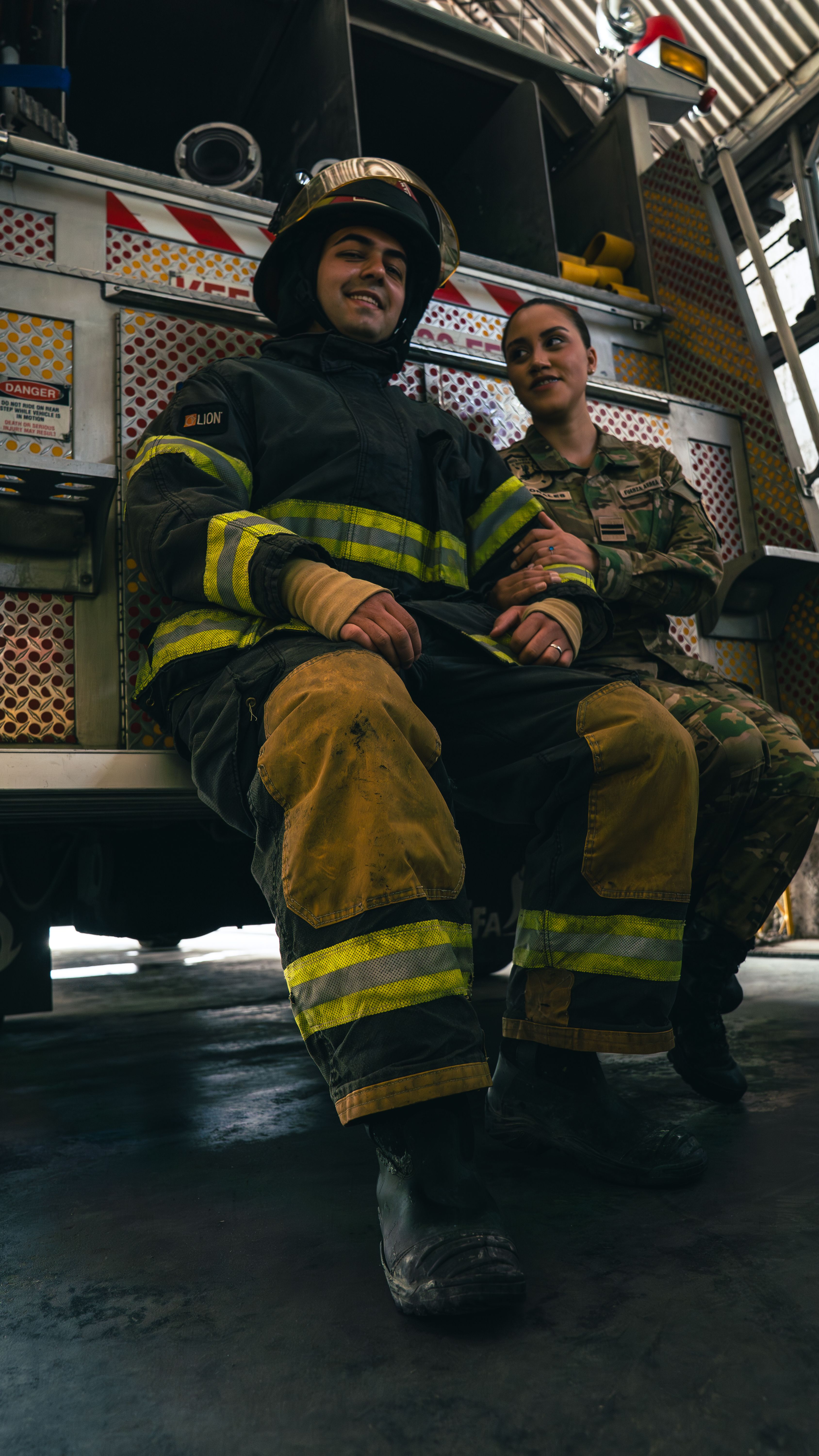 Firefighter and Soldier Sitting Together in Harmony · Free Stock Photo