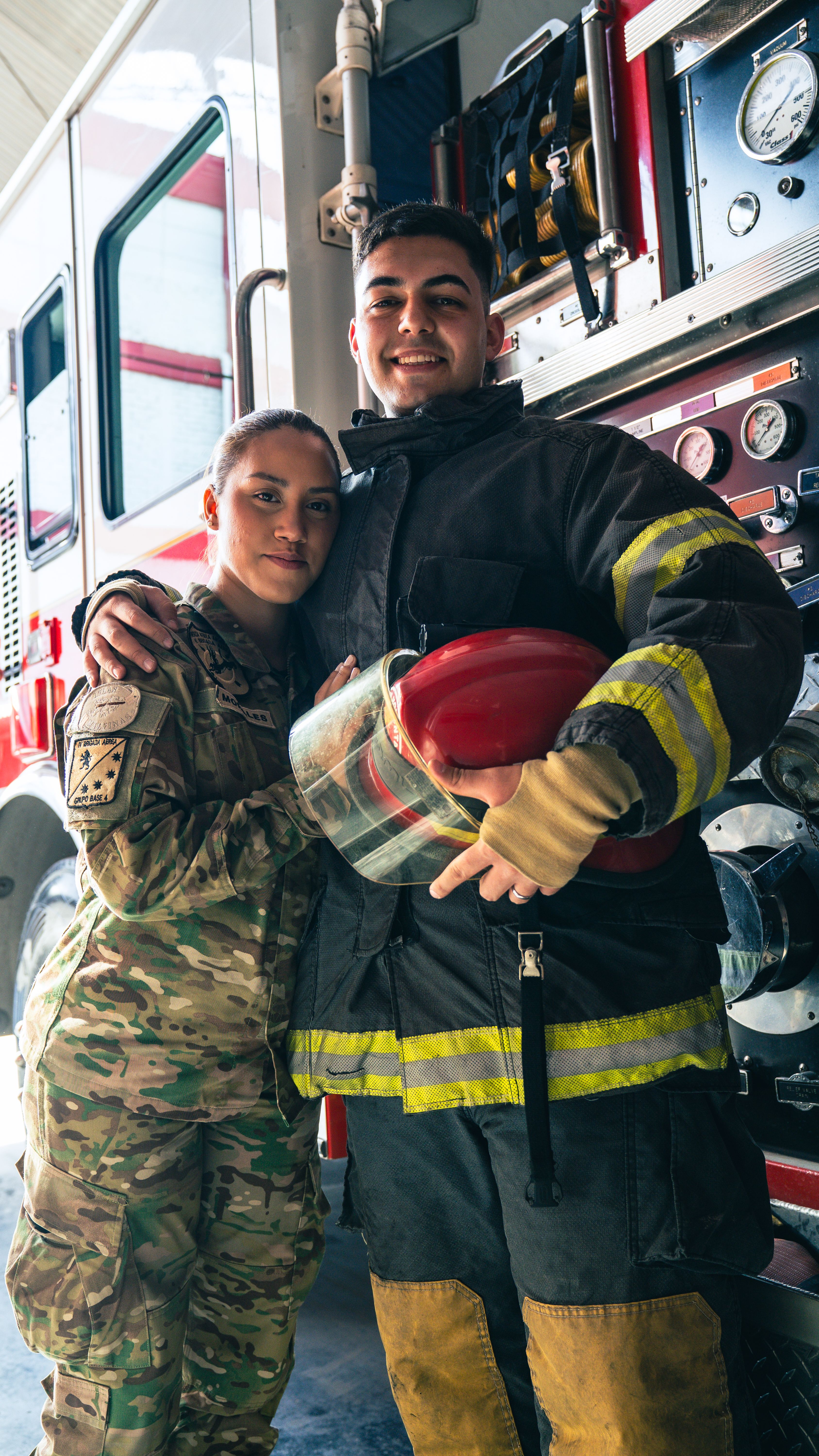 Firefighter and Soldier Posing Together Outdoors · Free Stock Photo