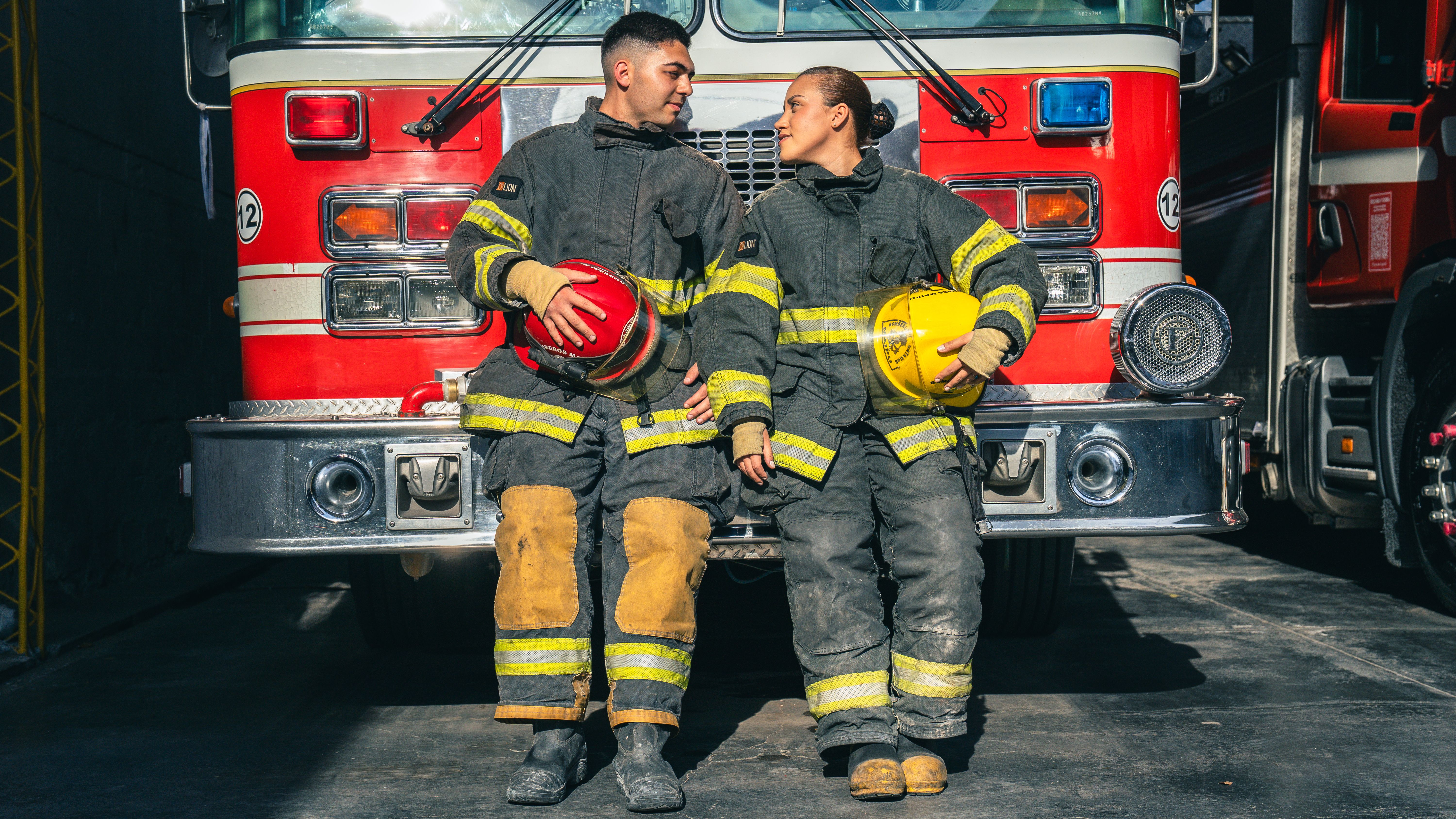 Brave Firefighters Resting by Fire Truck · Free Stock Photo