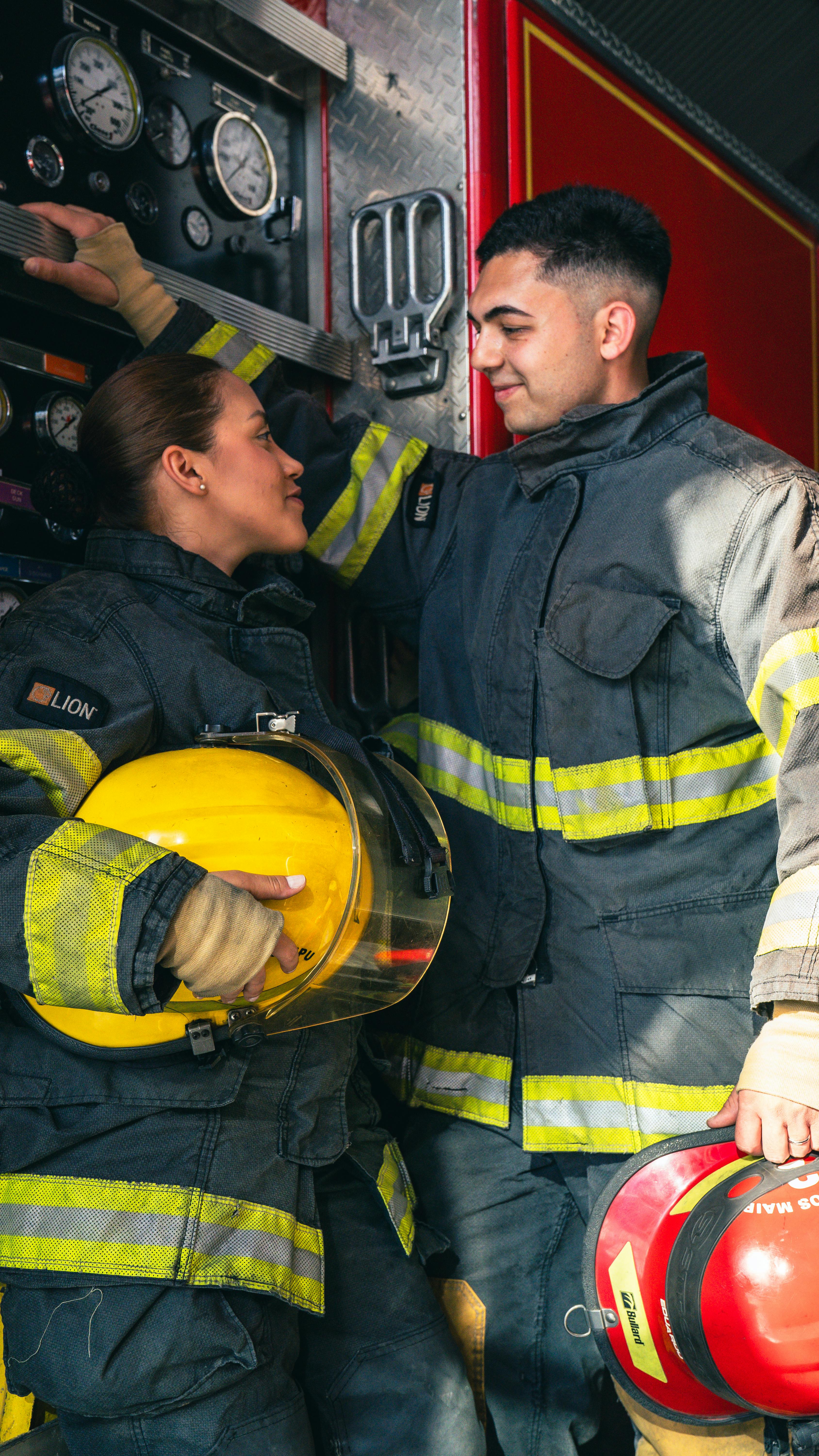 Yellow Hard Hat on Brown and Yellow Fireman's Suit · Free Stock Photo