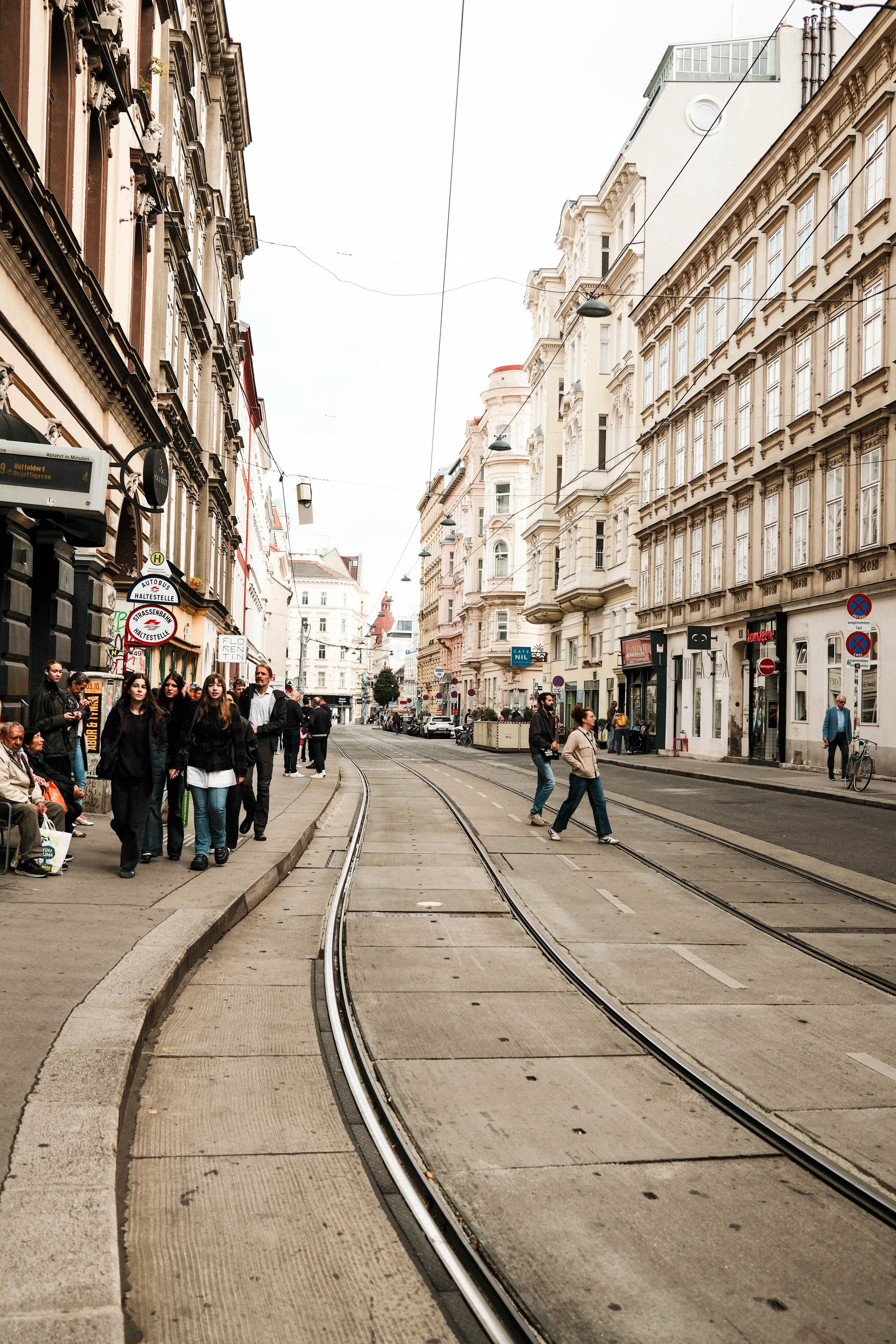 Bustling Street in Vienna with Tram Tracks · Free Stock Photo