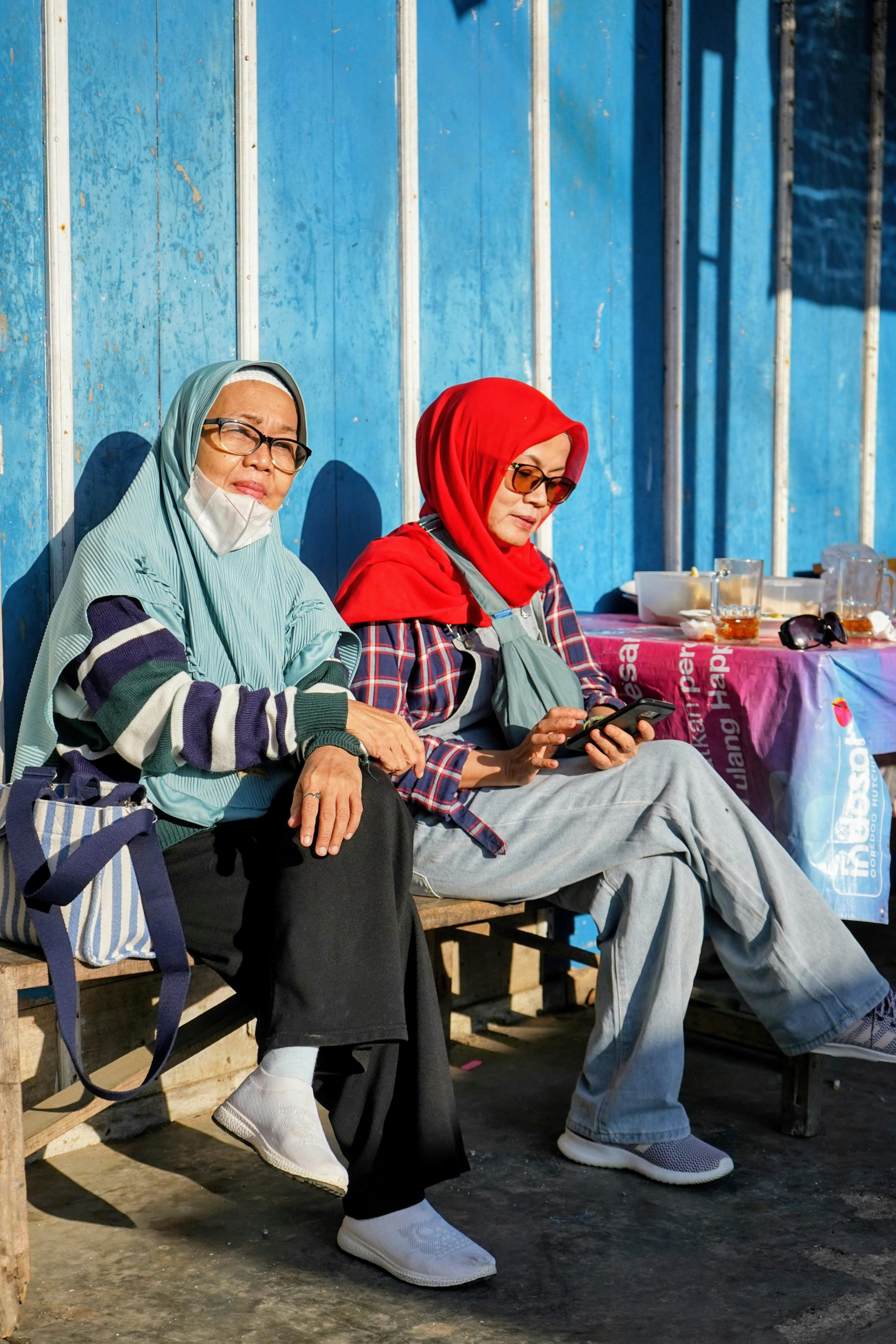 Two Women Relaxing Outdoors in Central Java · Free Stock Photo