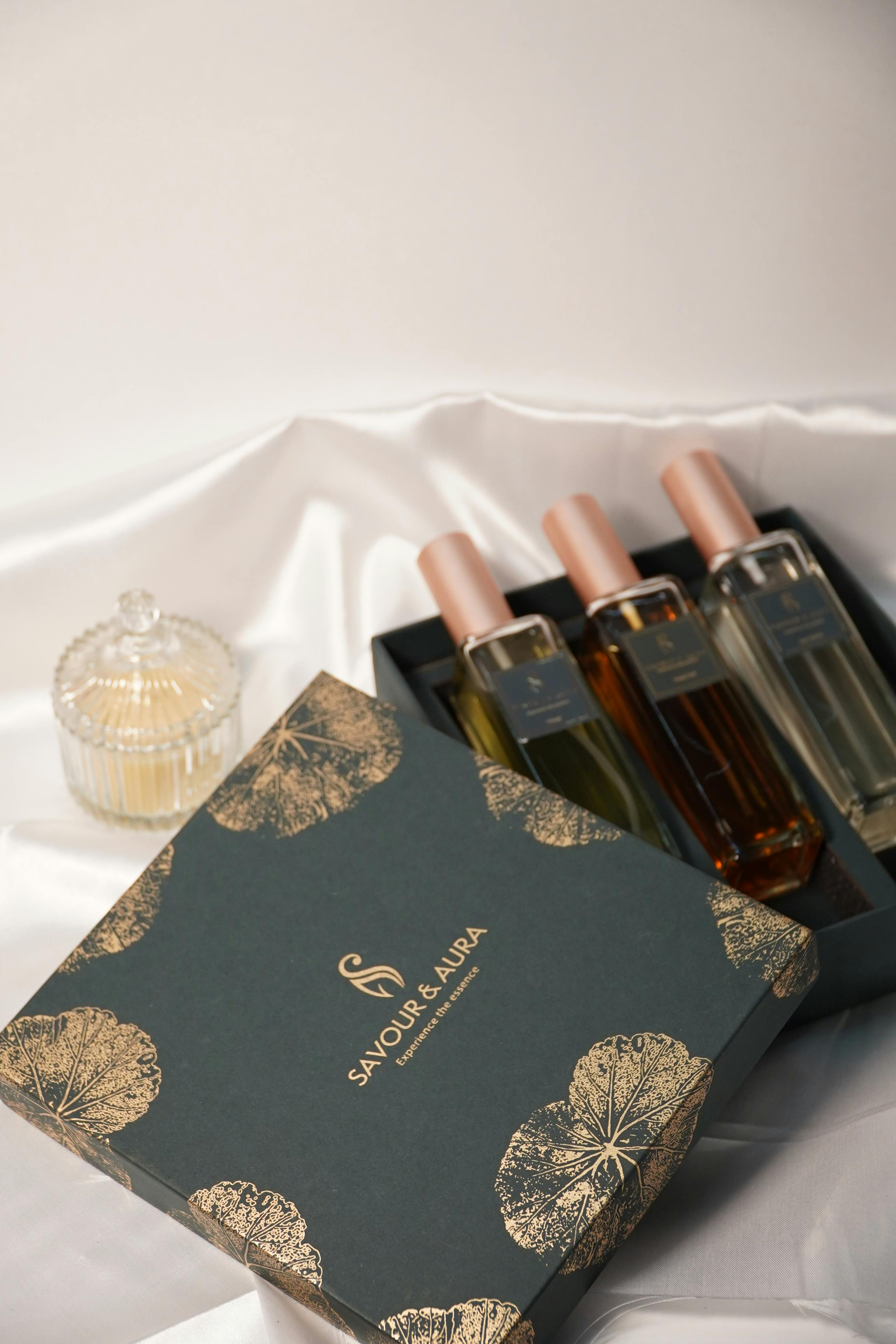 Elegant Gift Set with Scented Oils and Candles · Free Stock Photo