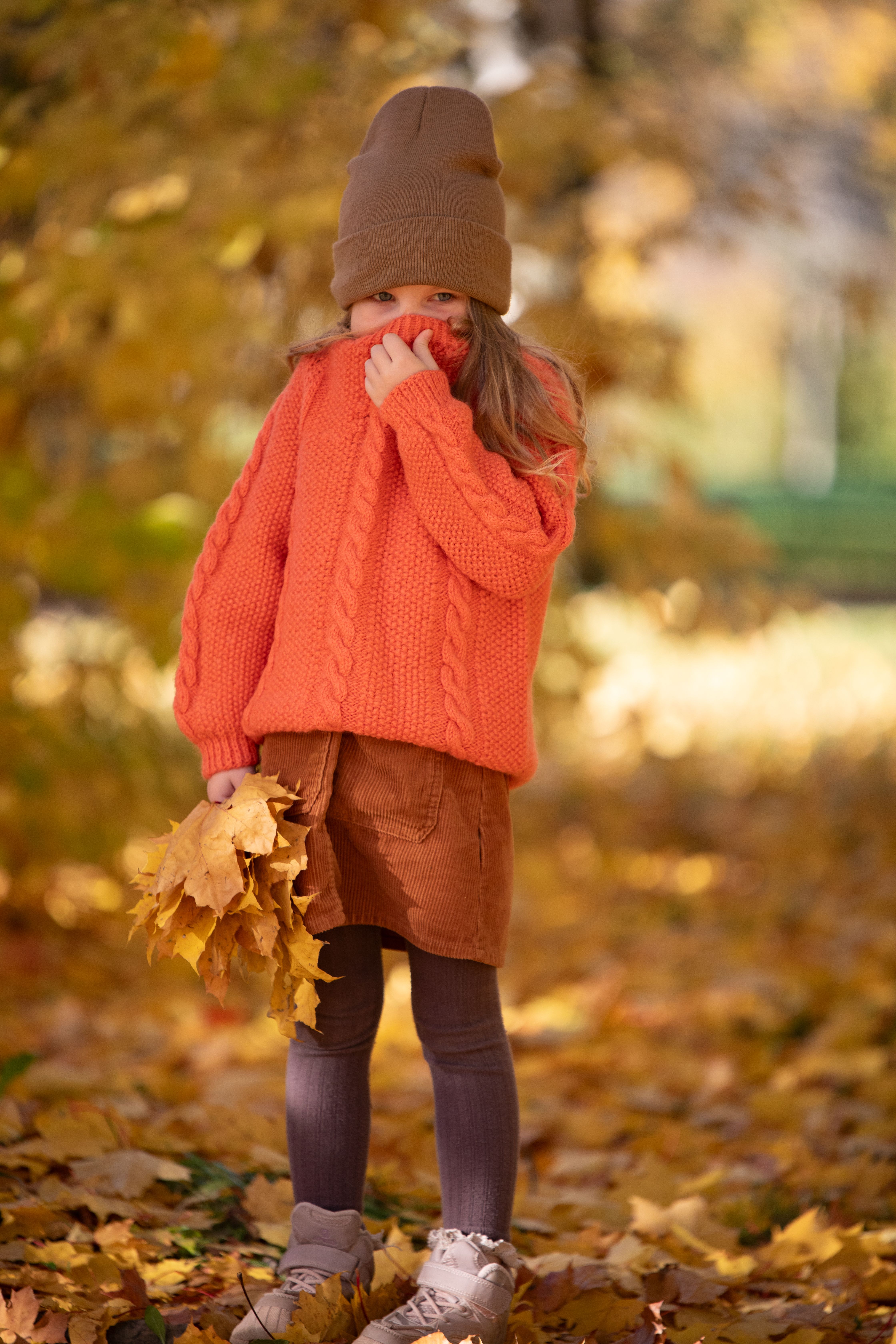 Child Enjoying Autumn Leaves Outdoors · Free Stock Photo