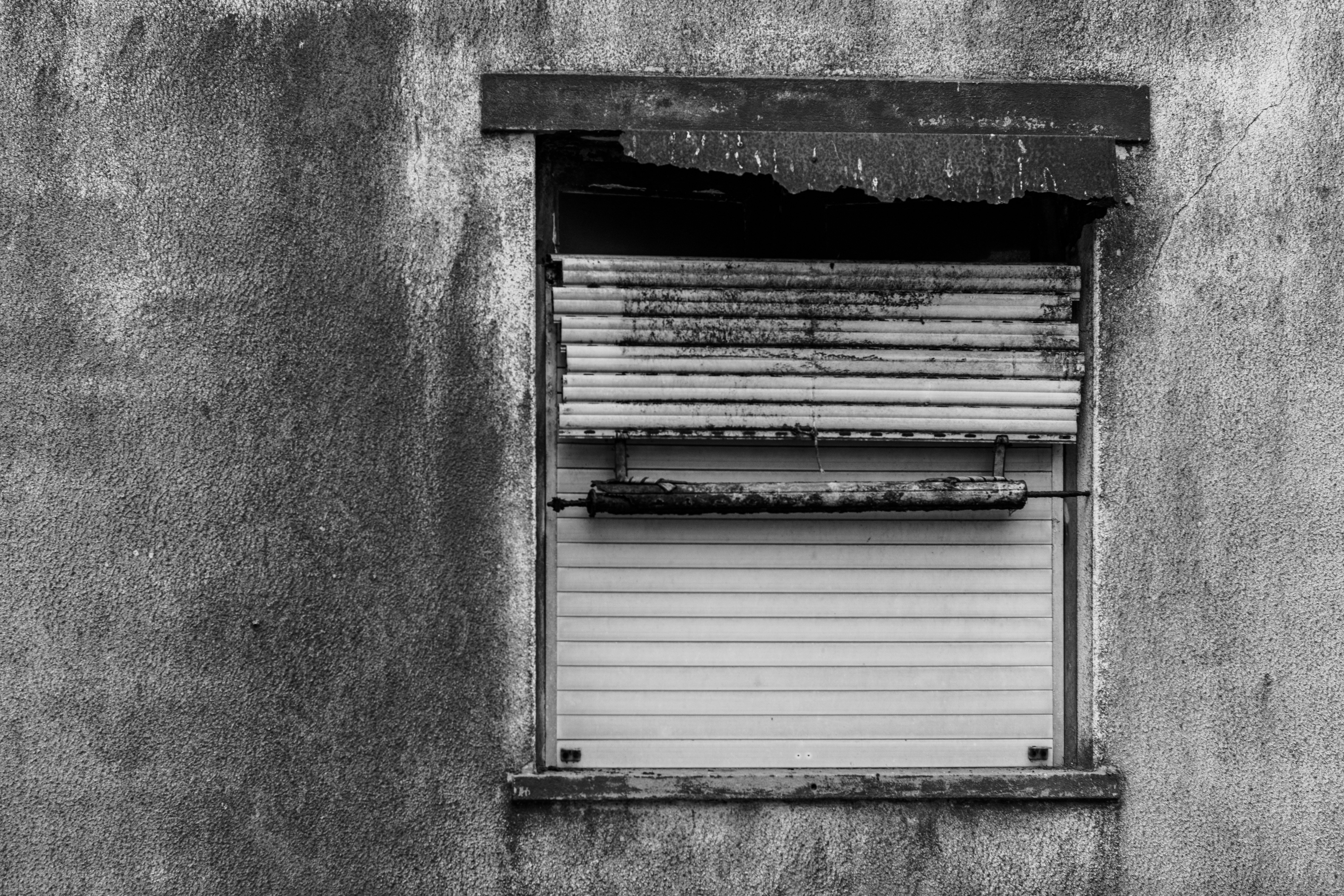 Aged Window with Broken Shutters in Black and White · Free Stock Photo