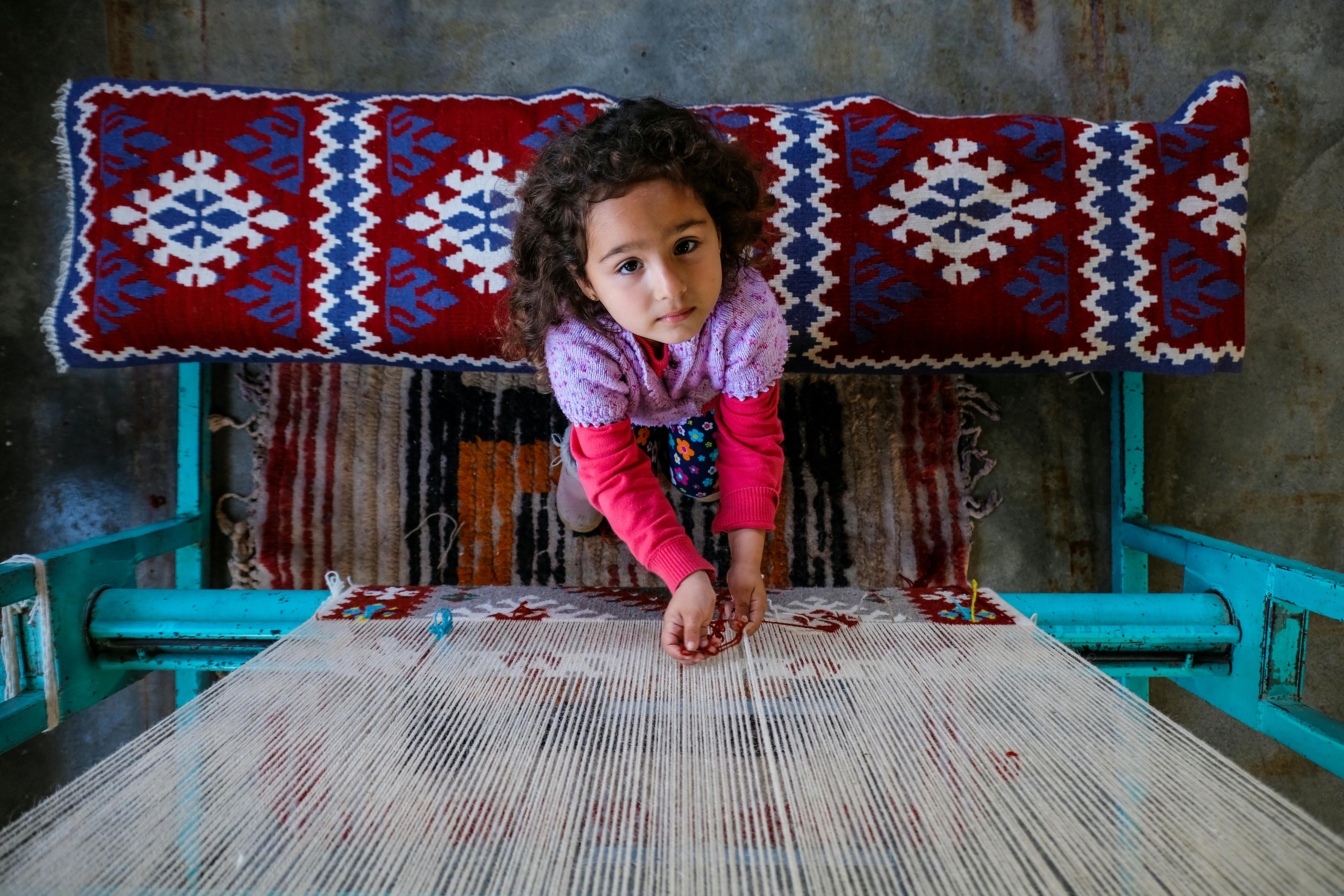 Young Girl Weaving on a Traditional Loom · Free Stock Photo