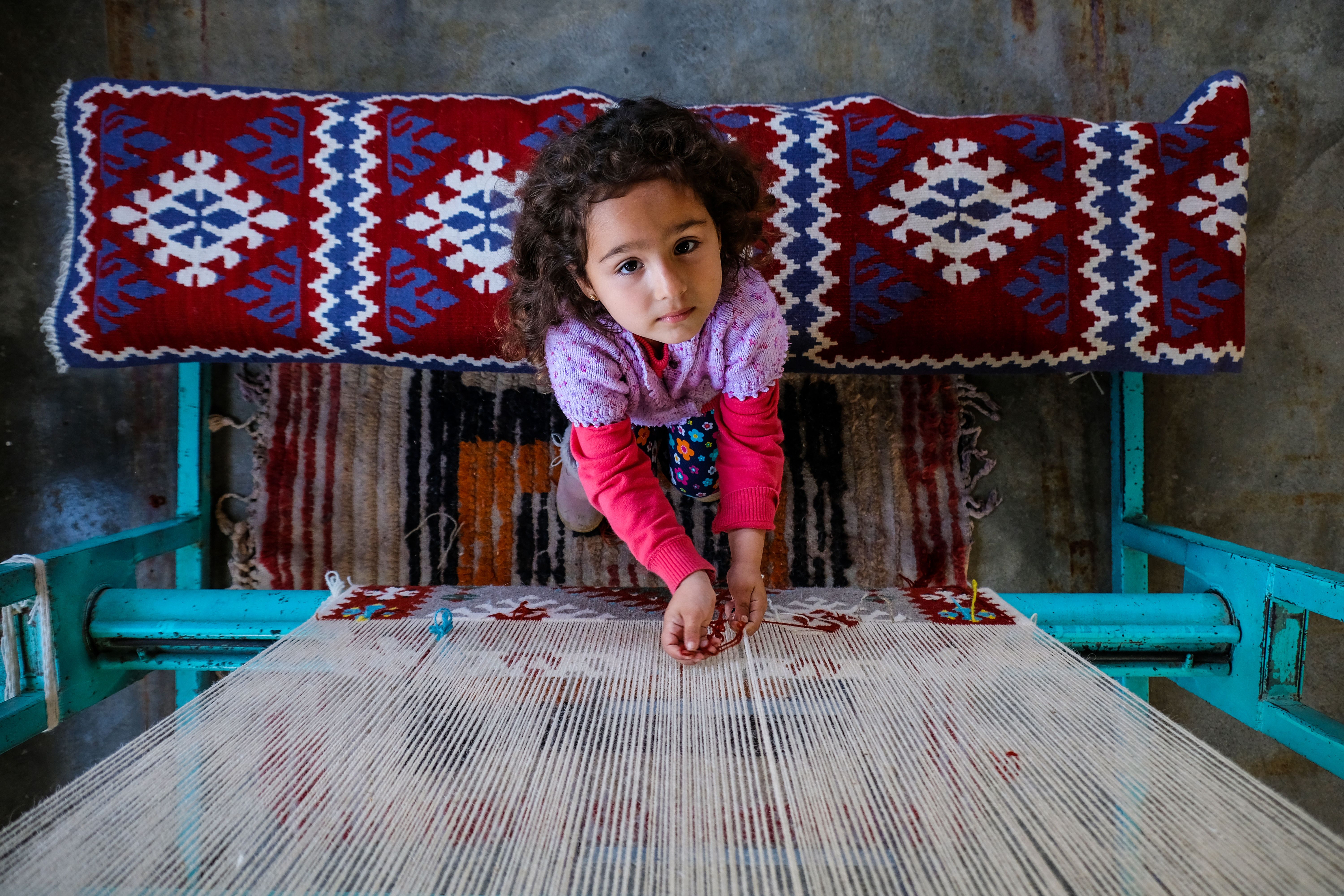 Young Girl Weaving on a Traditional Loom · Free Stock Photo