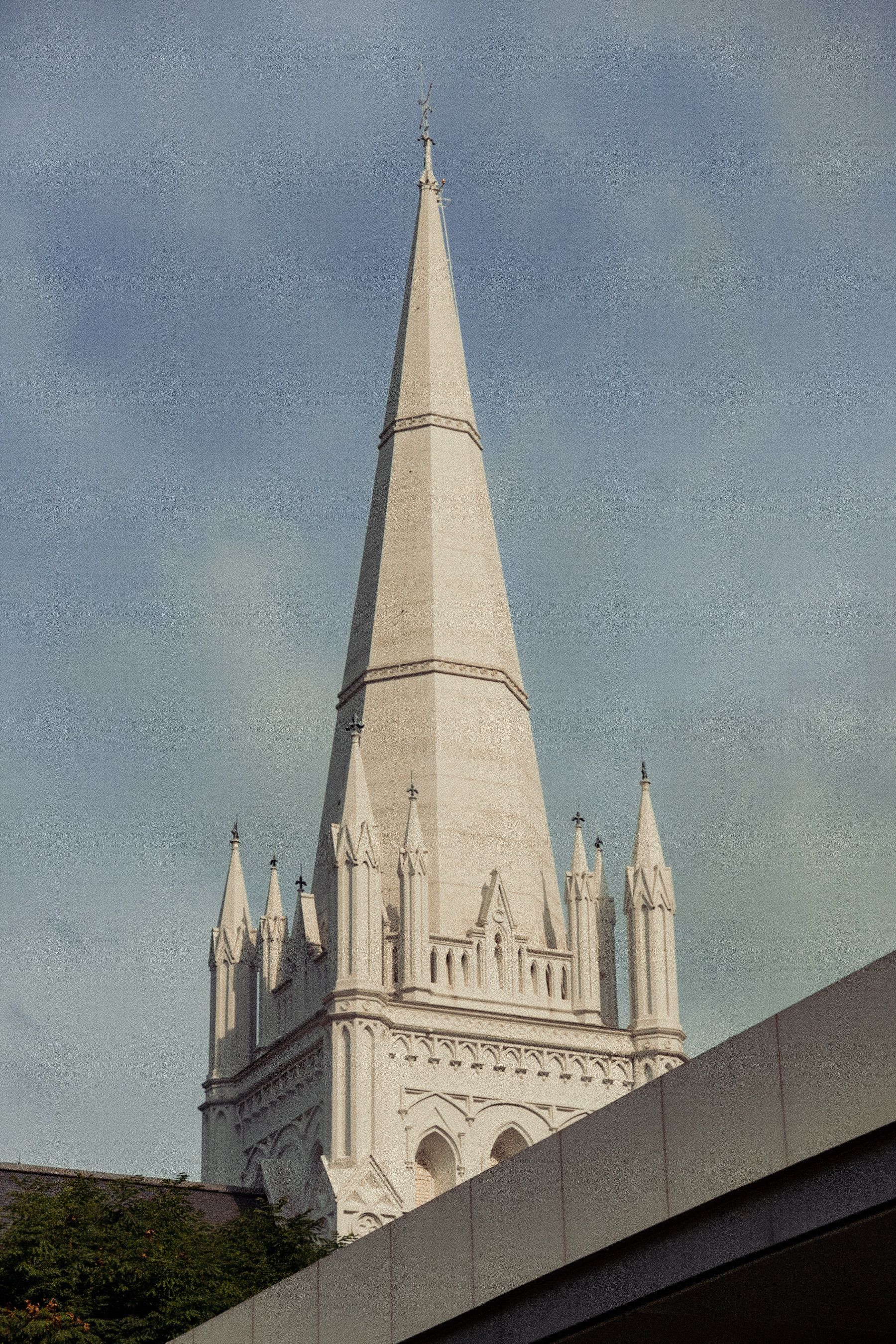 Gothic Cathedral Spire Against Blue Sky · Free Stock Photo