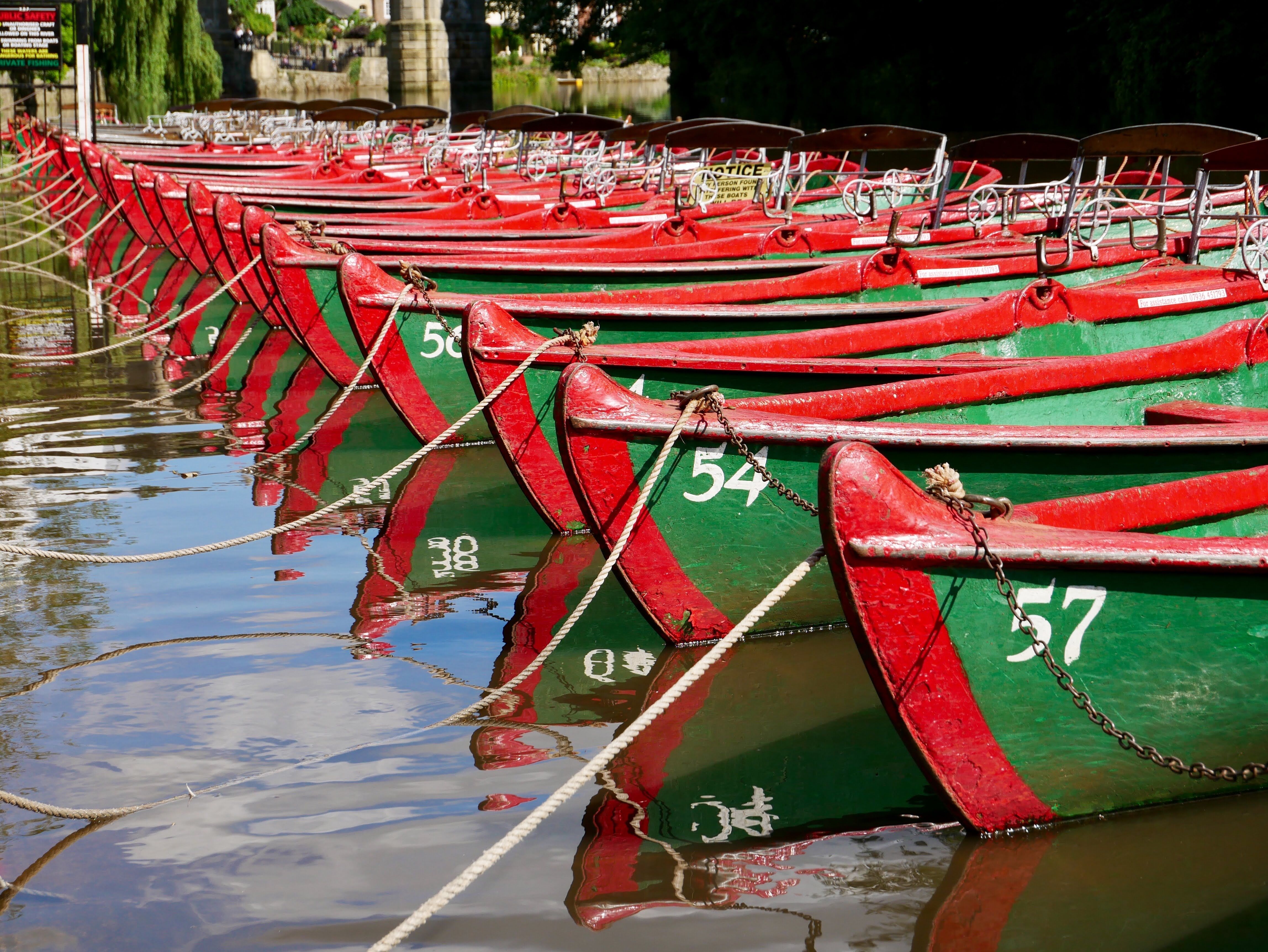 Row of Red and Green Boats on River Nidd · Free Stock Photo