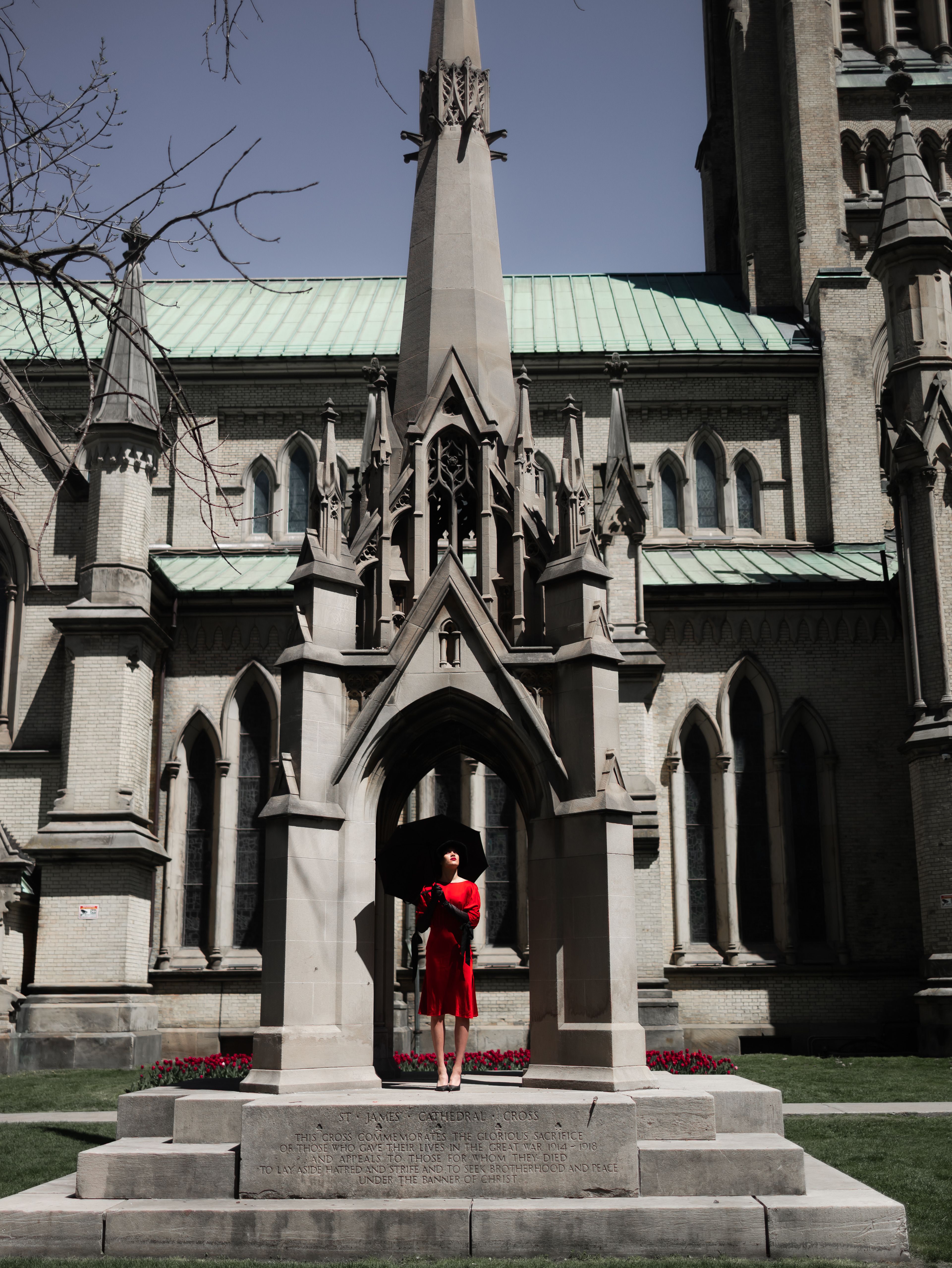 Elegant Woman in Red Dress at Gothic Church · Free Stock Photo