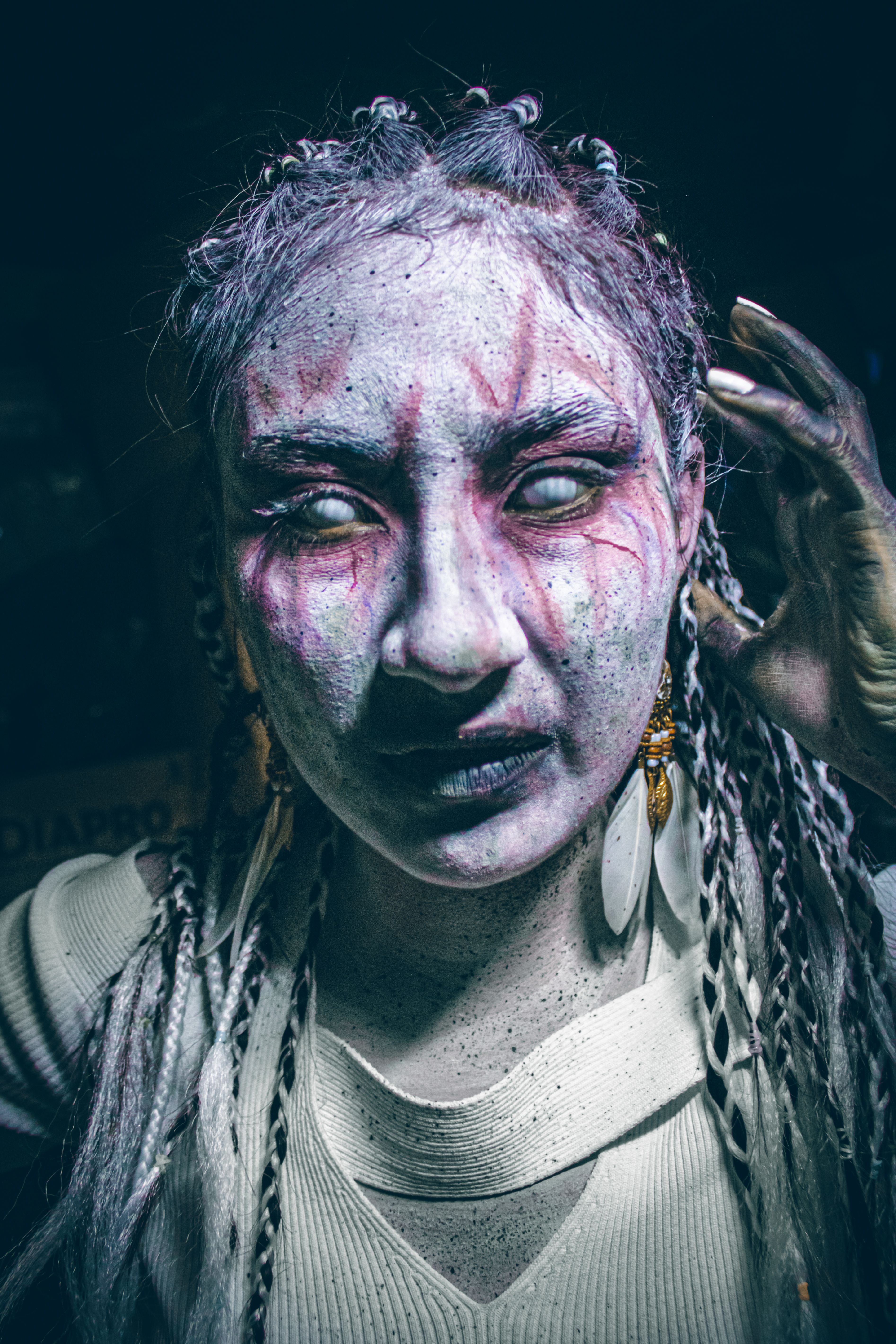 Spooky Portrait with Artistic Makeup in Dark Setting · Free Stock Photo