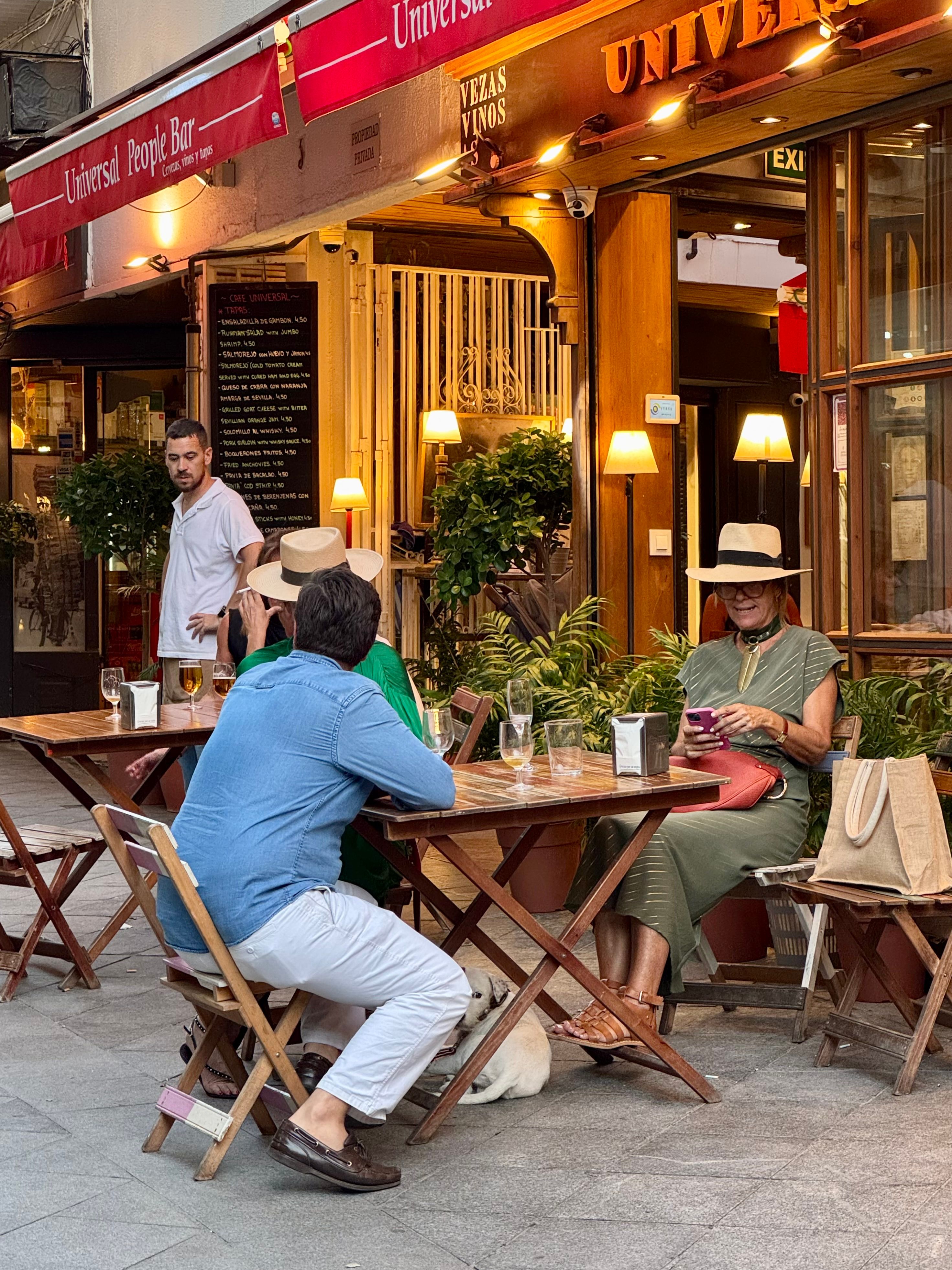 Outdoor Café Scene with Relaxed Patrons · Free Stock Photo