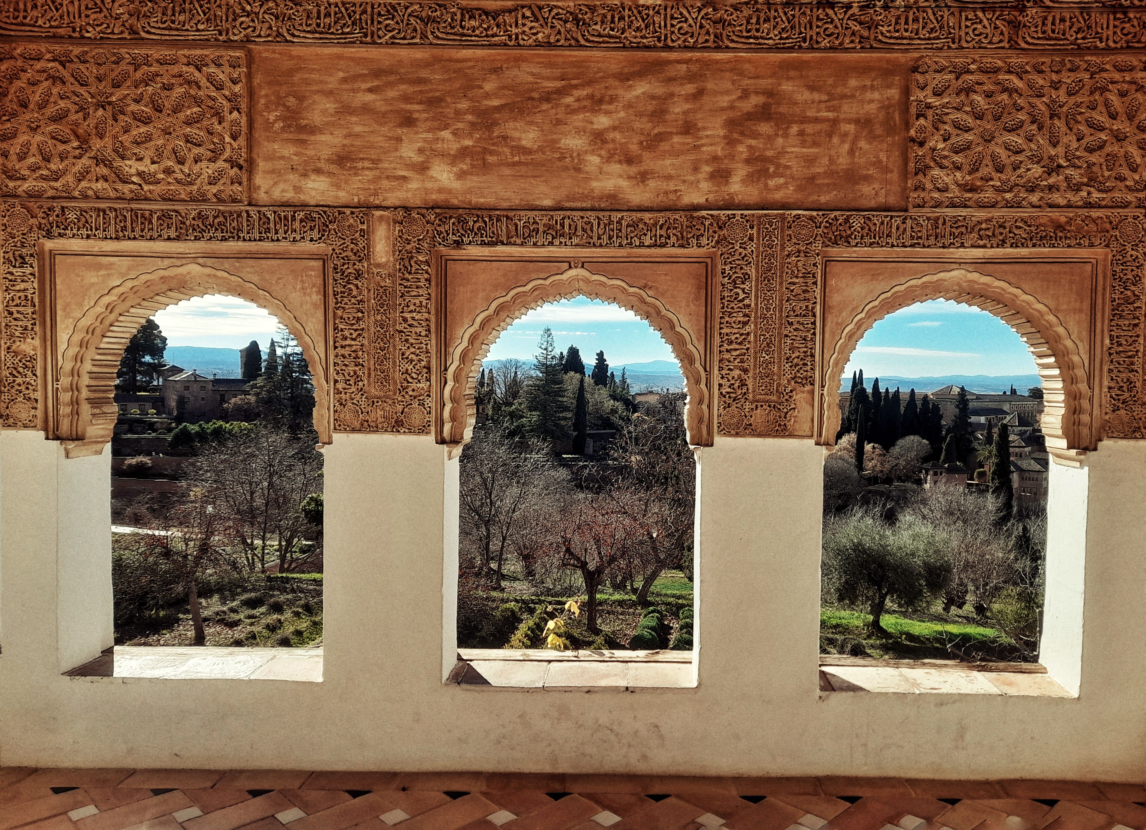 Intricate Archways Framing Scenic Garden View · Free Stock Photo