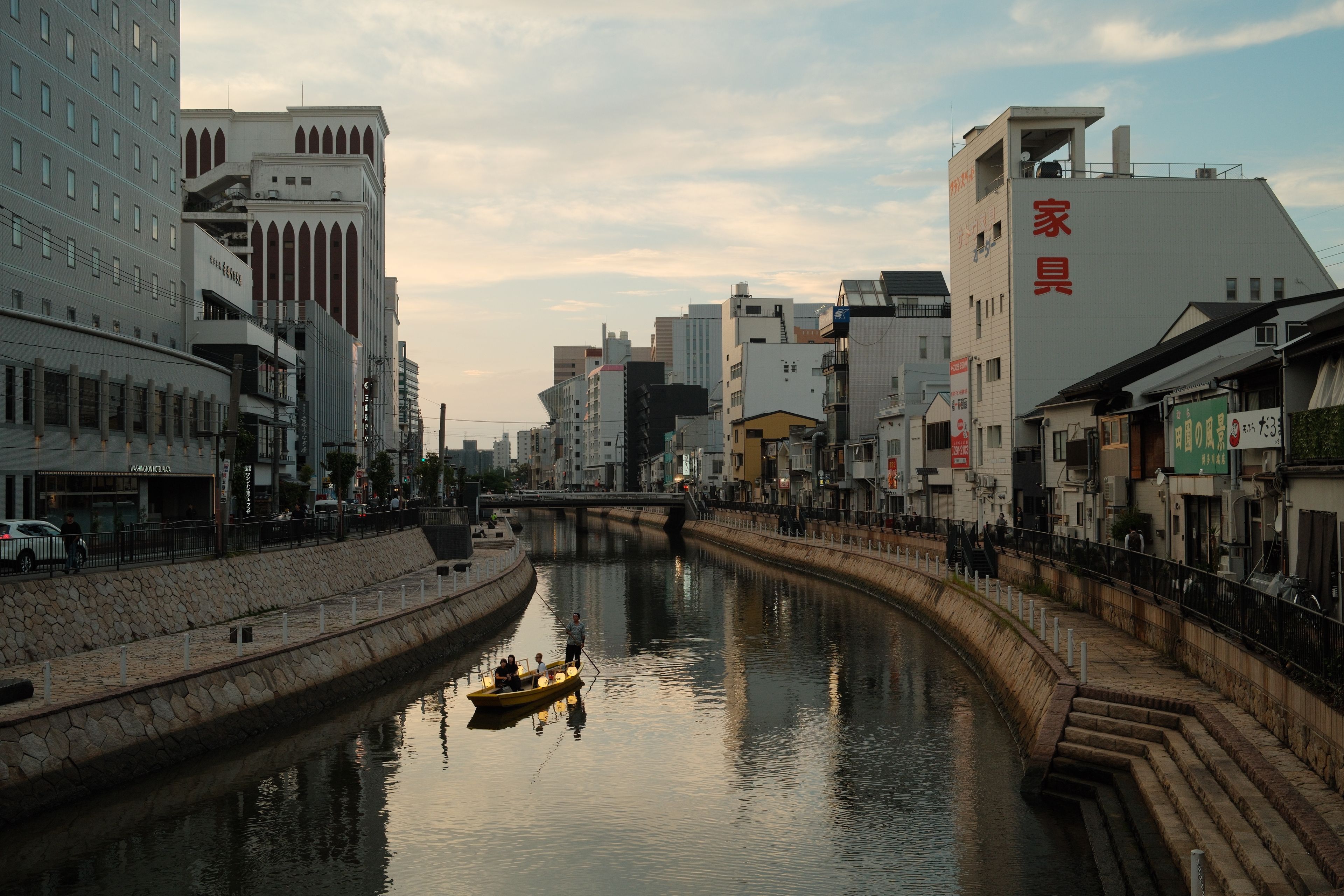 Serene River Scene in Urban Japanese Cityscape · Free Stock Photo