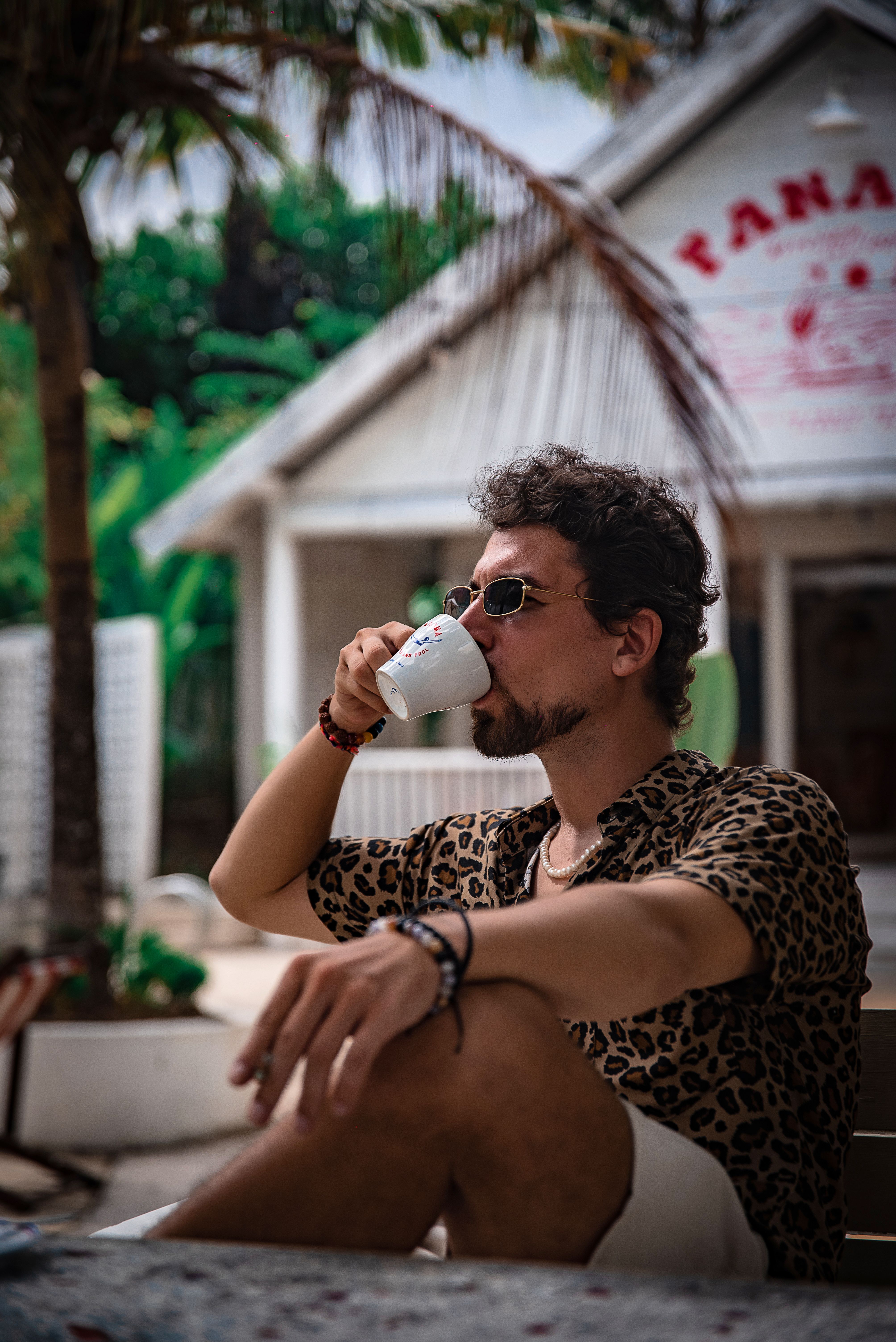 Relaxed Man Enjoying Coffee Outdoors in Bali · Free Stock Photo
