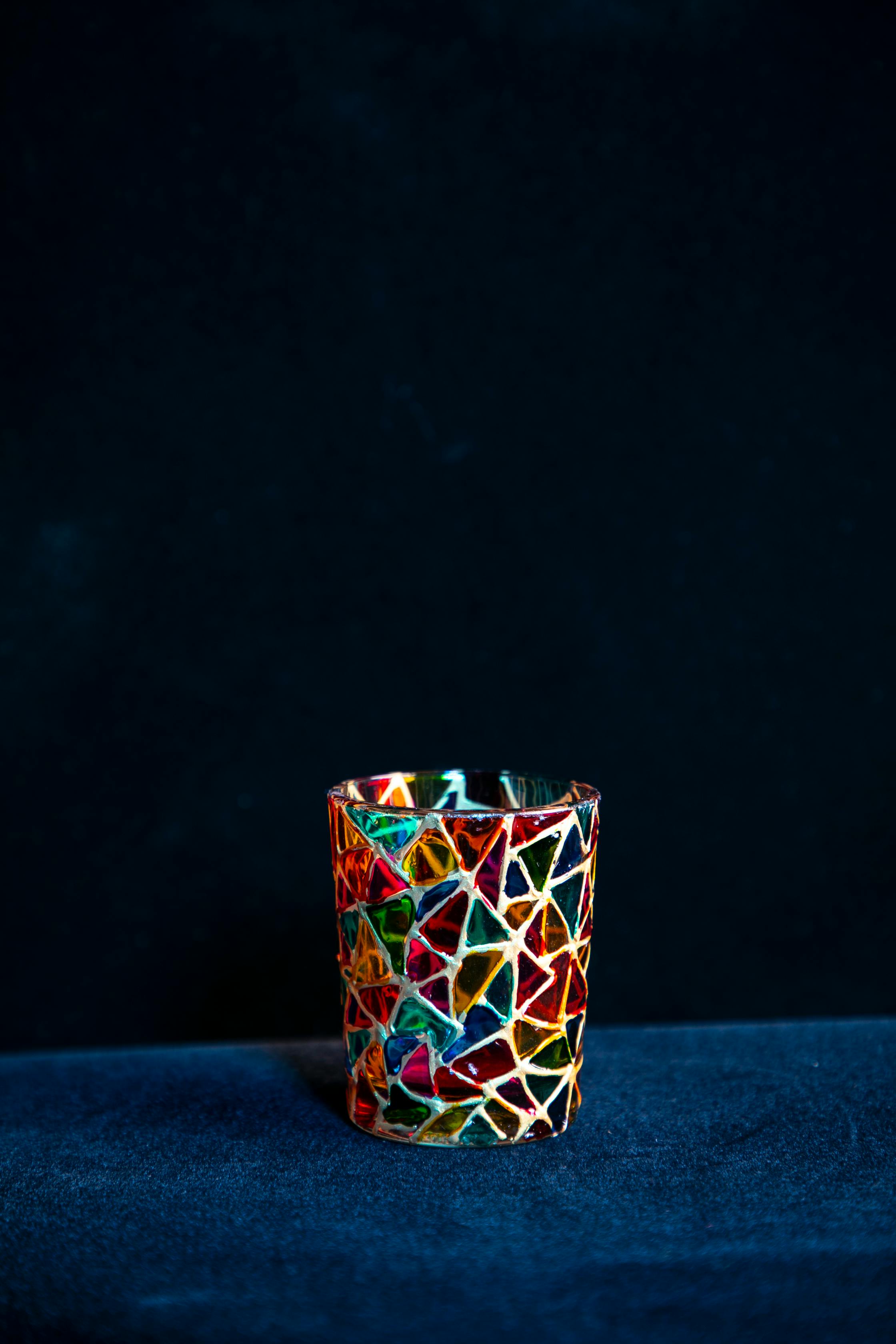 Stained Glass Cup on Blue Table · Free Stock Photo