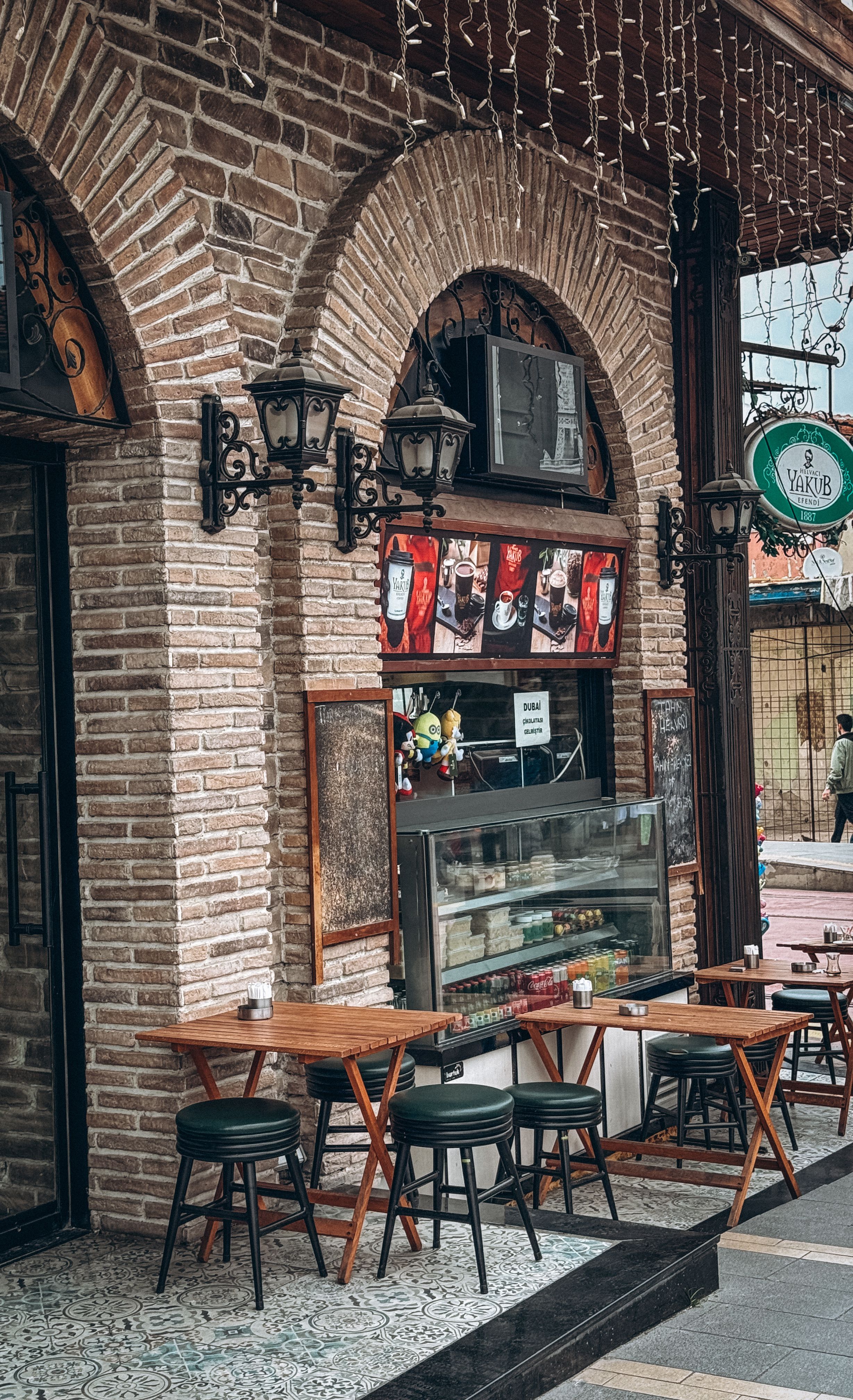 Charming Outdoor Café with Rustic Brick Decor · Free Stock Photo