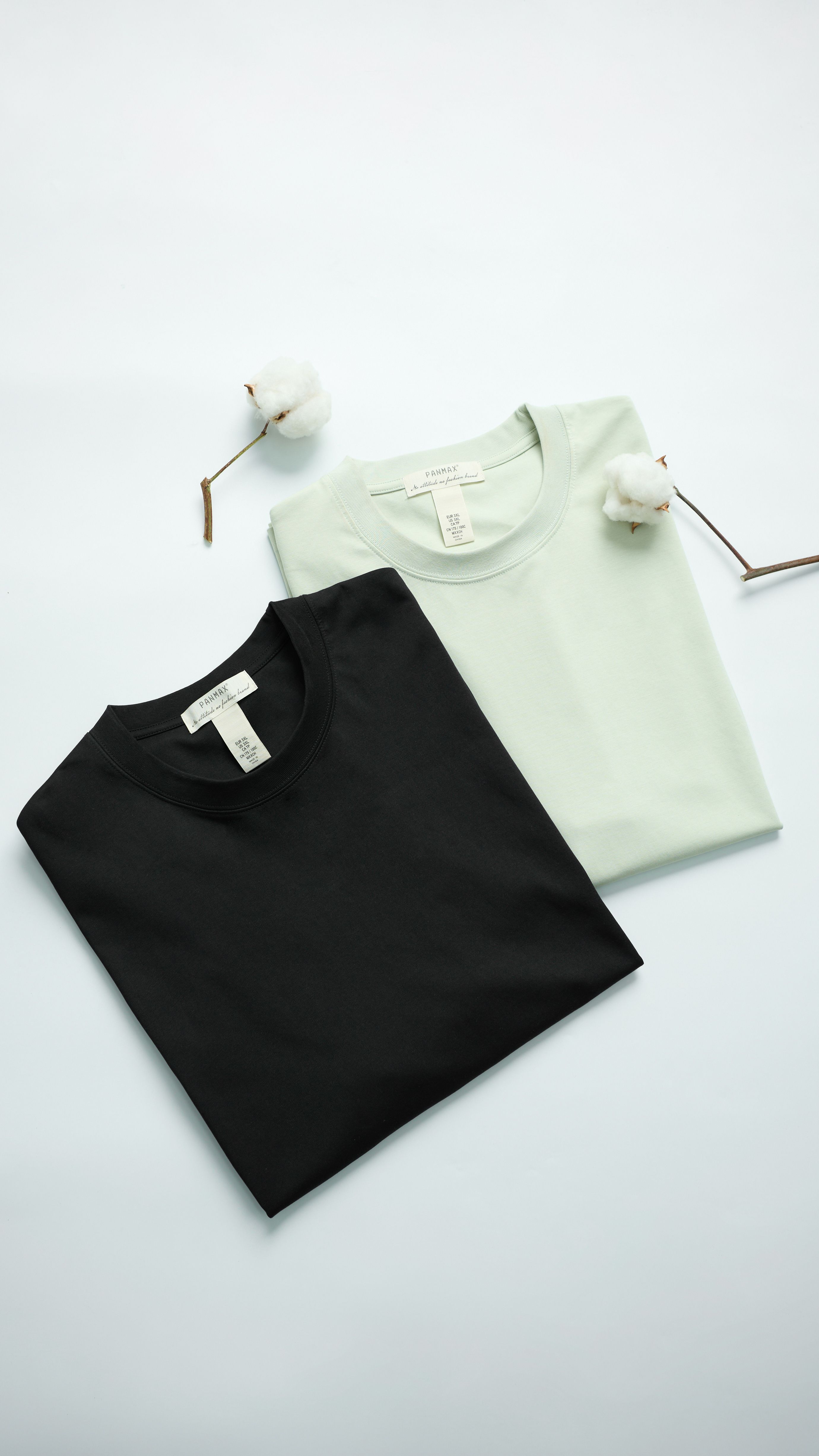 Minimalist Flat Lay of Cotton T-Shirts and Cotton Flowers · Free Stock ...