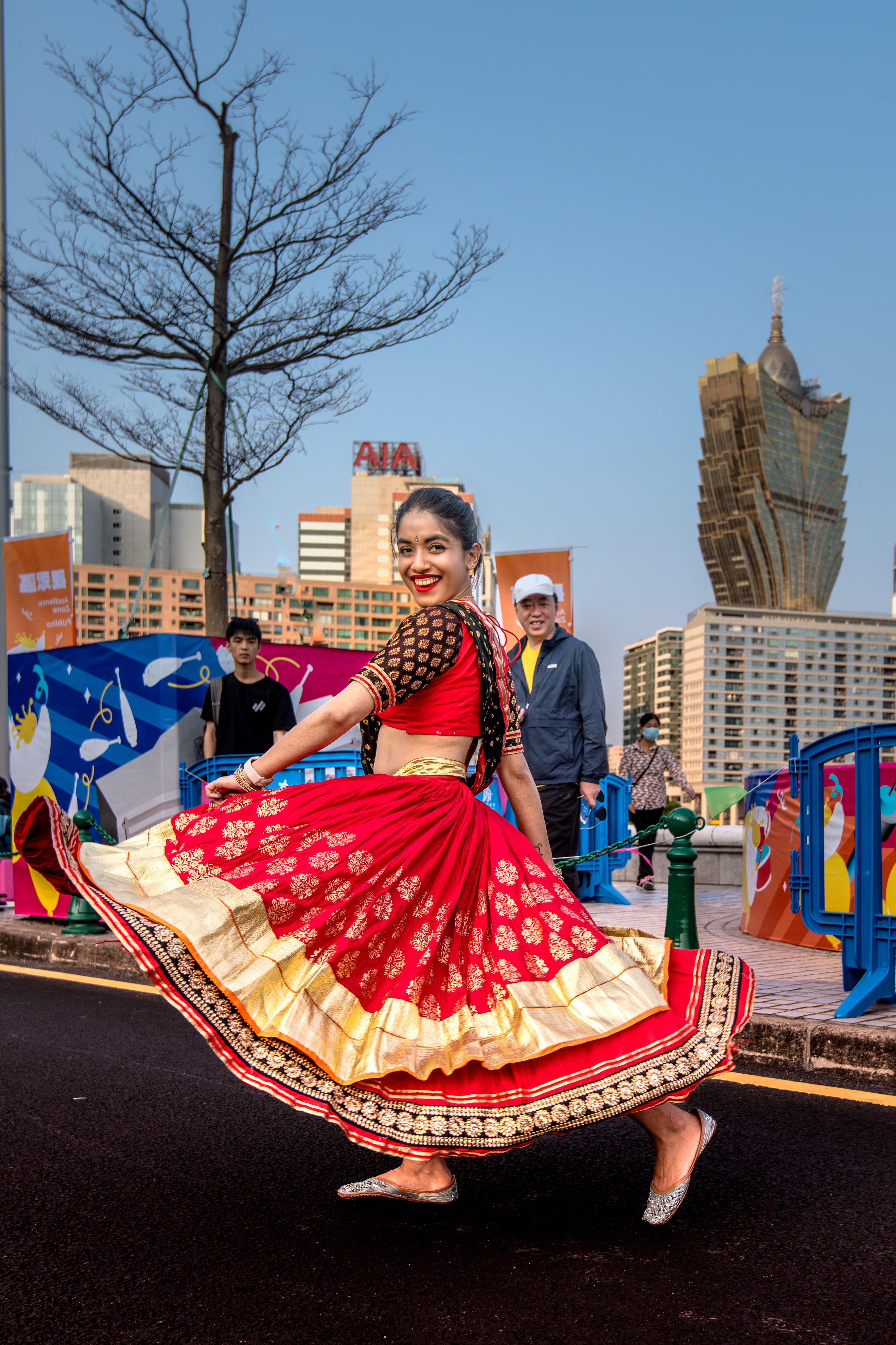 Joyful Woman in Red Dress Twirling Outdoors · Free Stock Photo