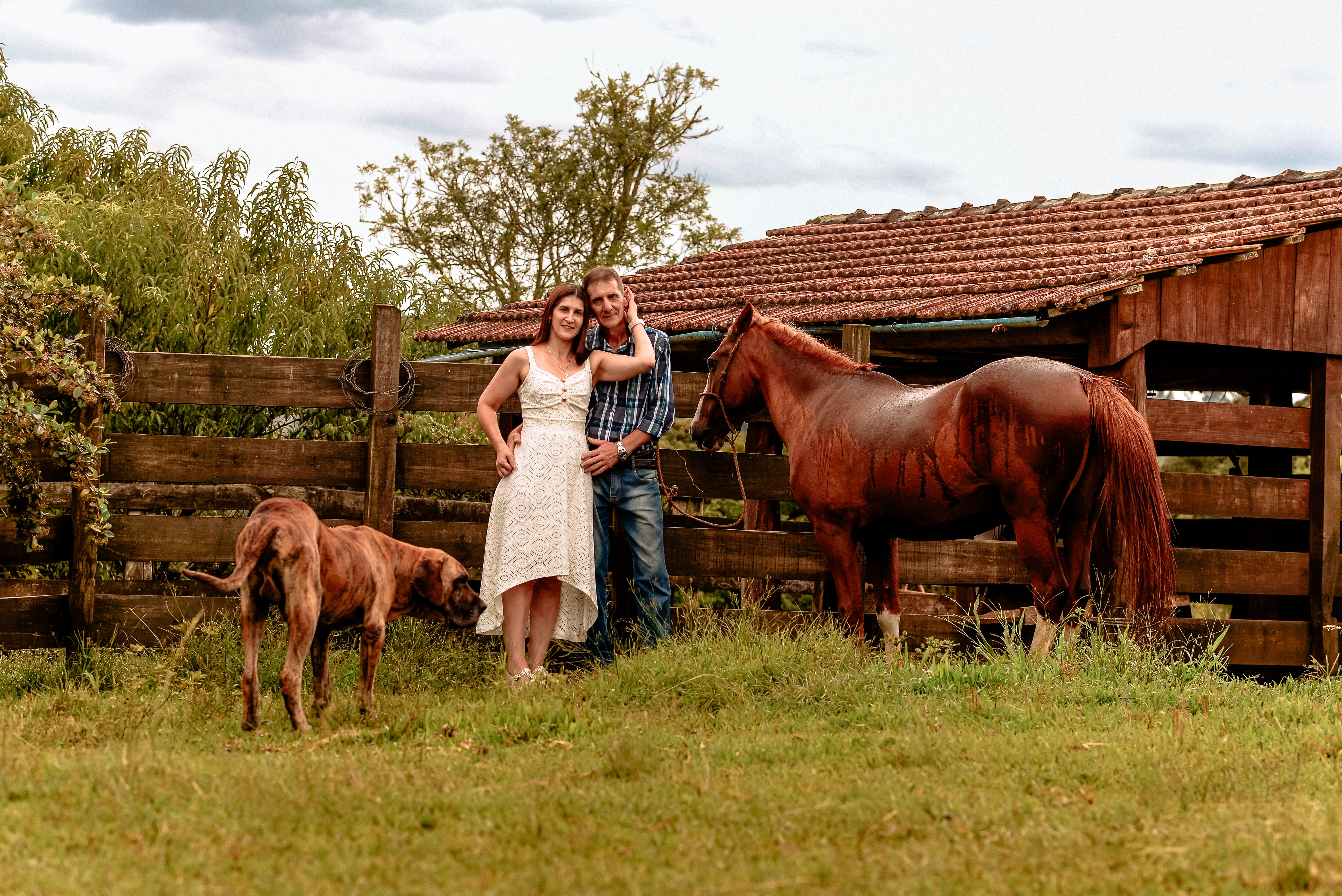 Charming Farm Scene with Couple and Animals · Free Stock Photo