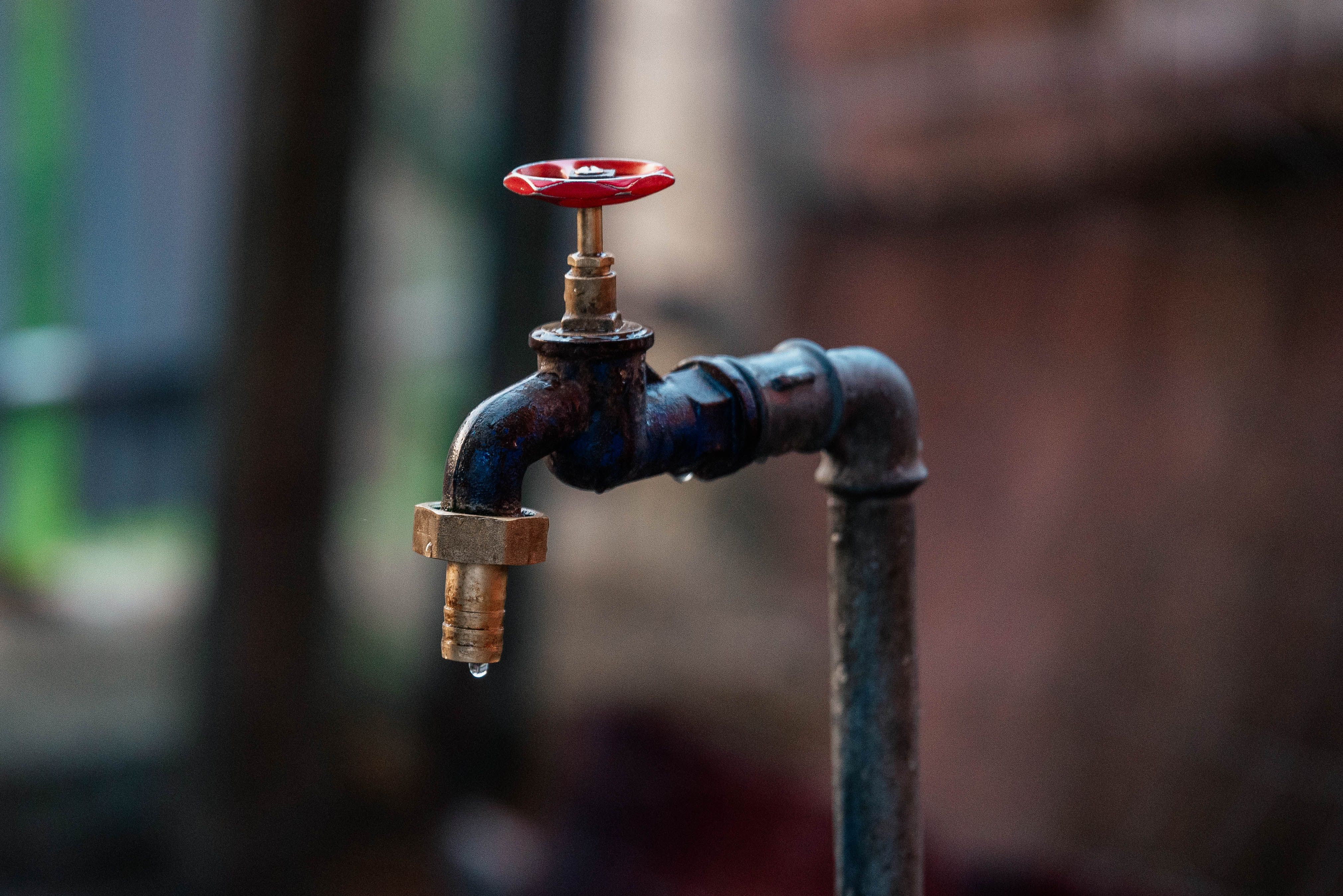 Rusty Outdoor Water Faucet Dripping Close-Up · Free Stock Photo