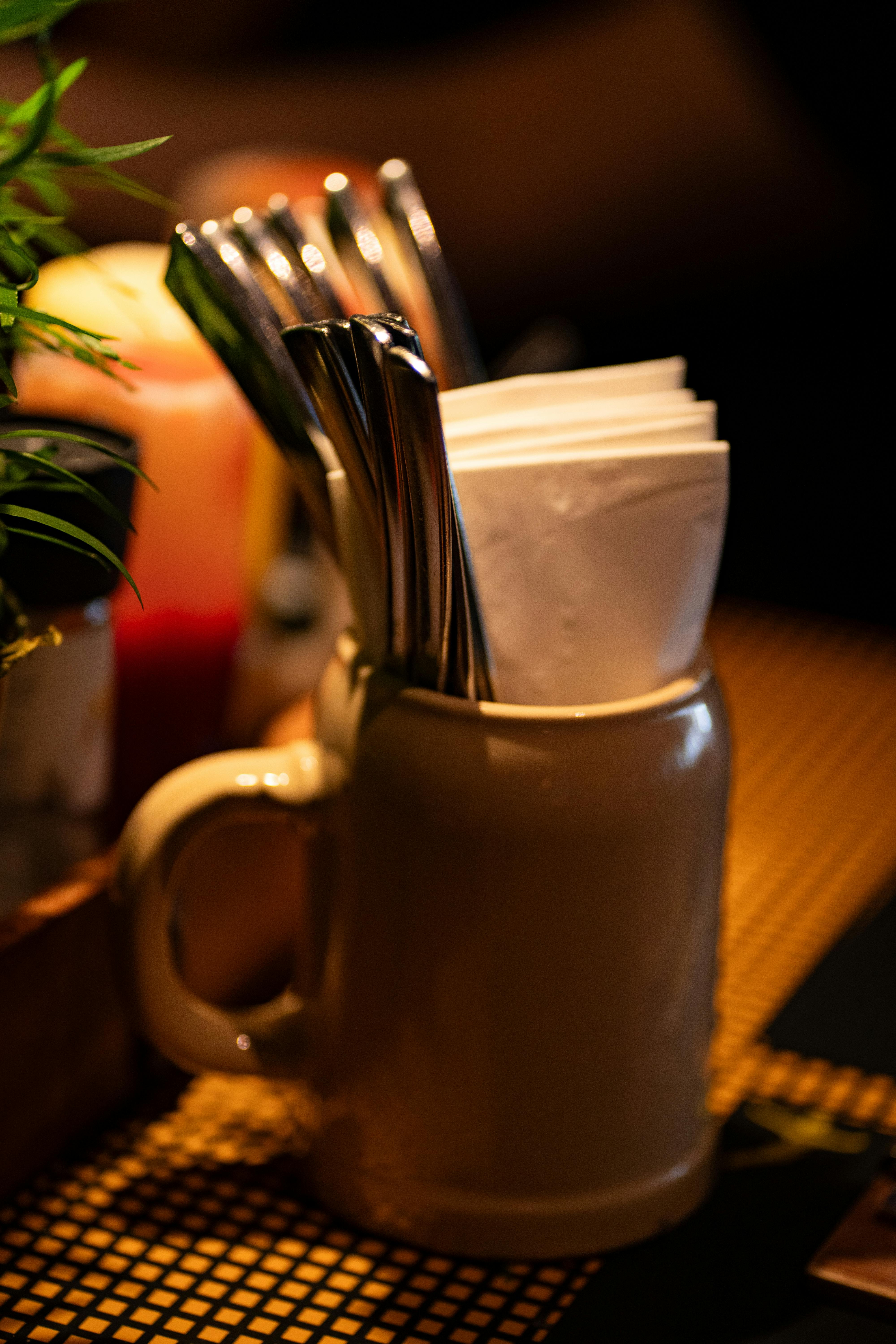 Cozy Table Setting with Cutlery in Mug · Free Stock Photo