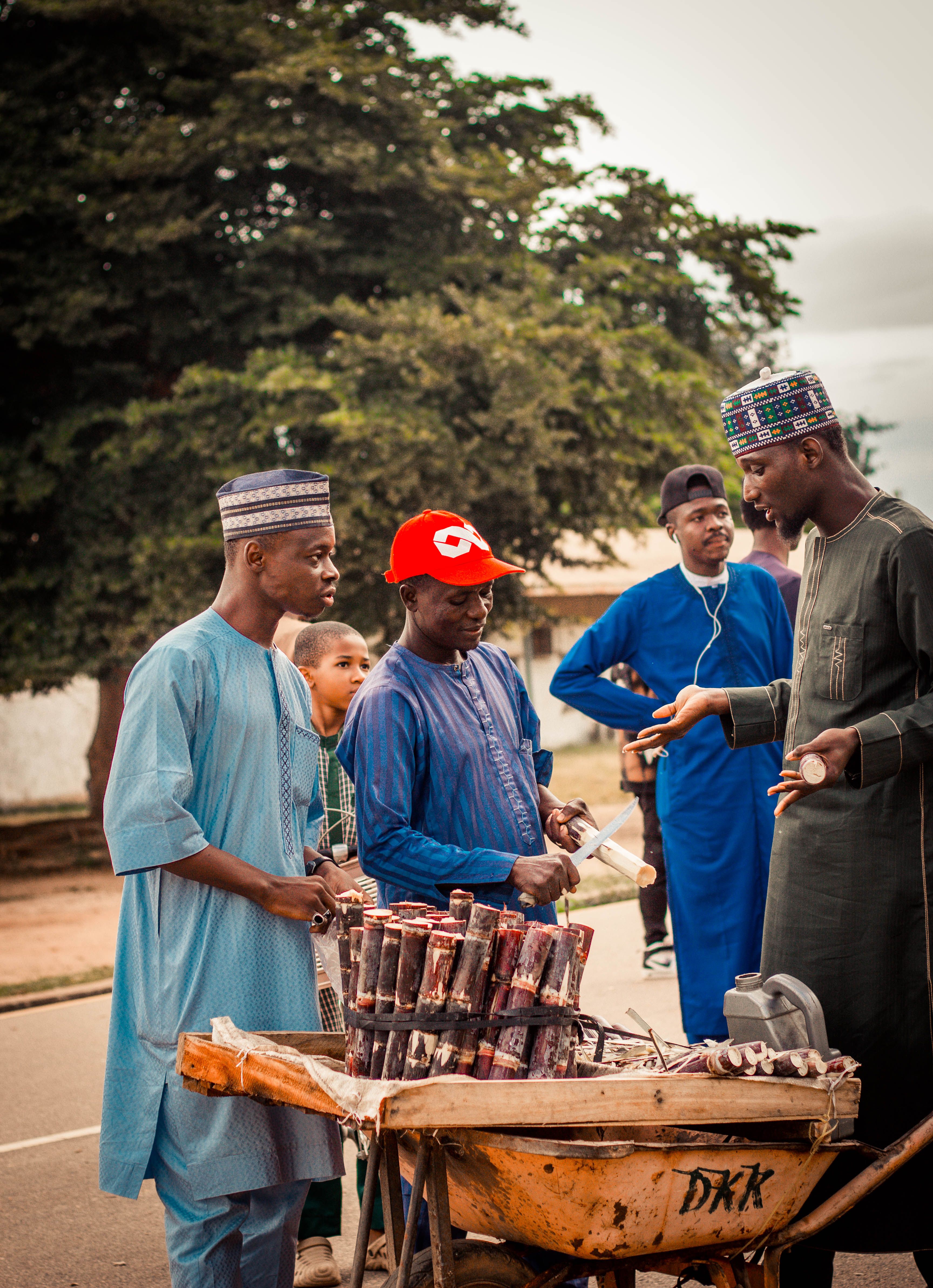 Street Vendor Selling Local Snacks Outdoors · Free Stock Photo