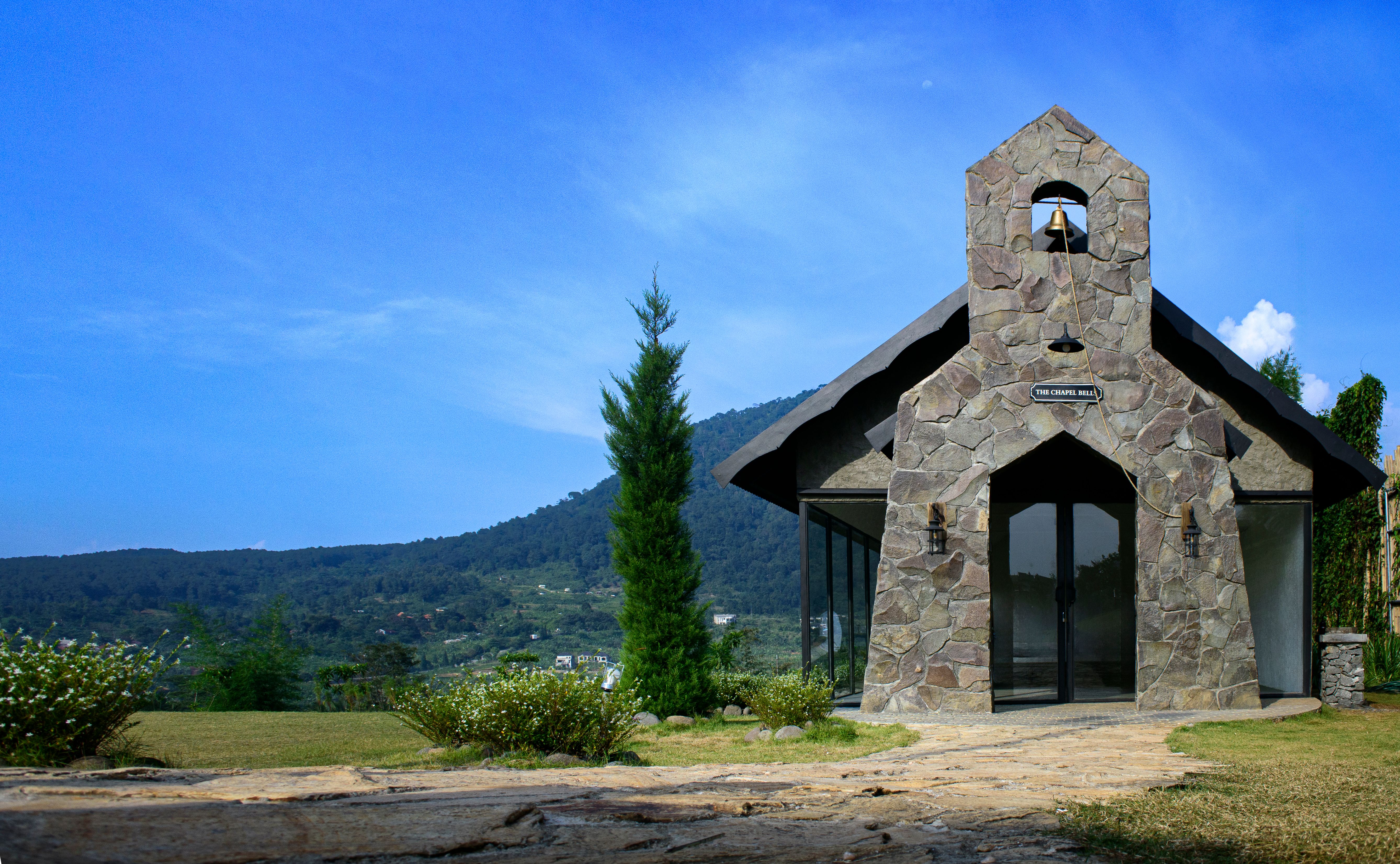 Charming Stone Chapel in Lush Landscape · Free Stock Photo
