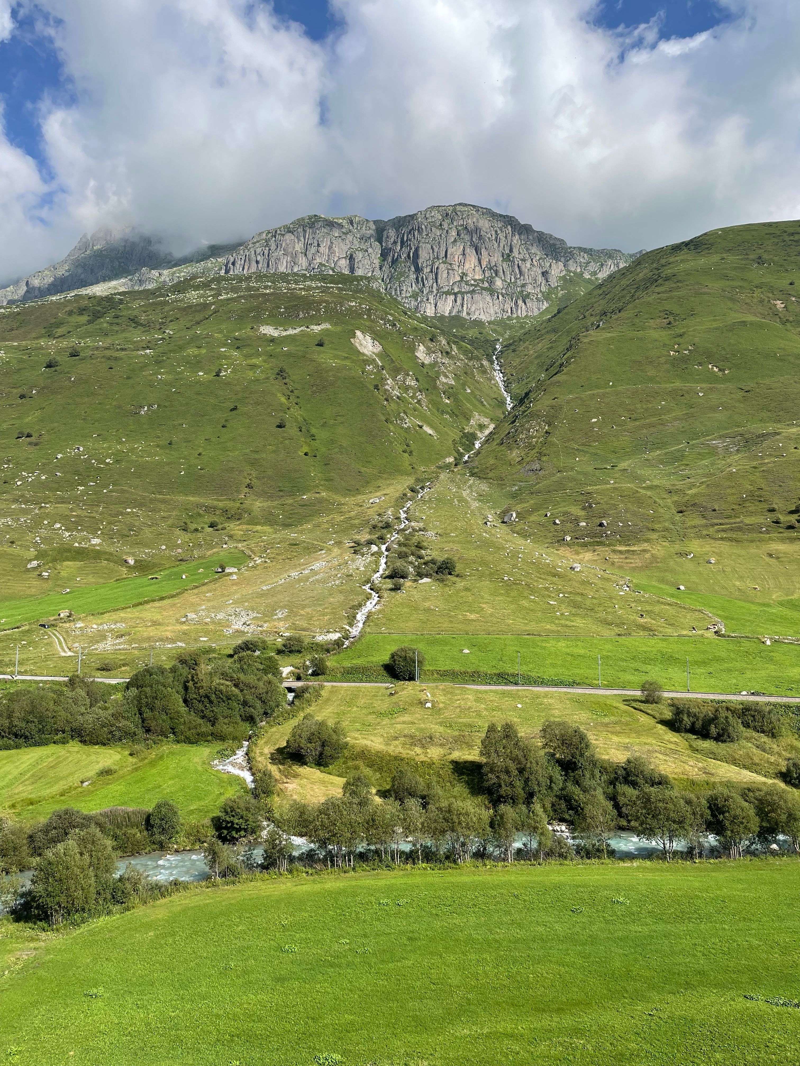 Scenic Mountain Stream in Verdant Valley · Free Stock Photo