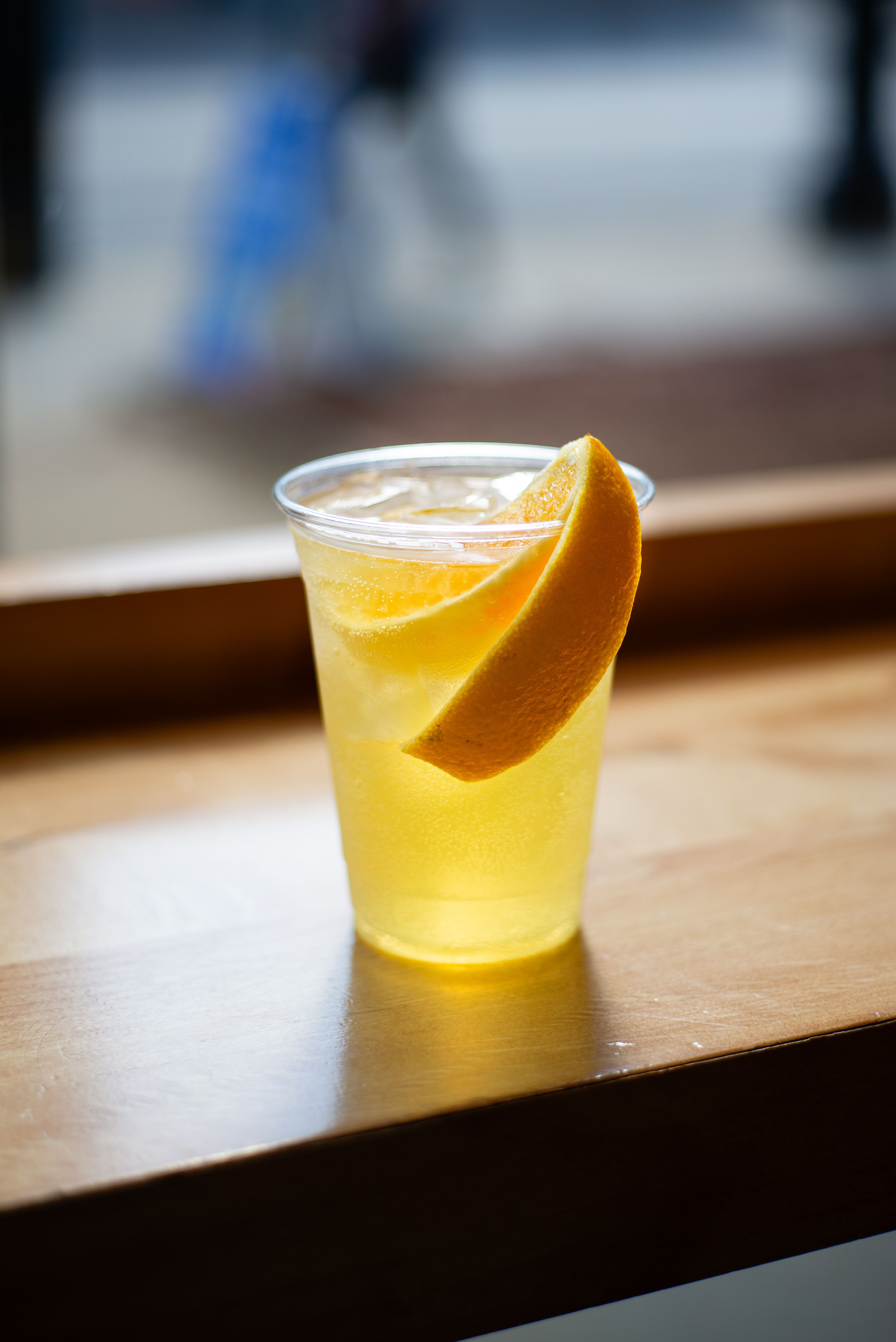 Refreshing Sparkling Orange Drink on Wooden Table · Free Stock Photo