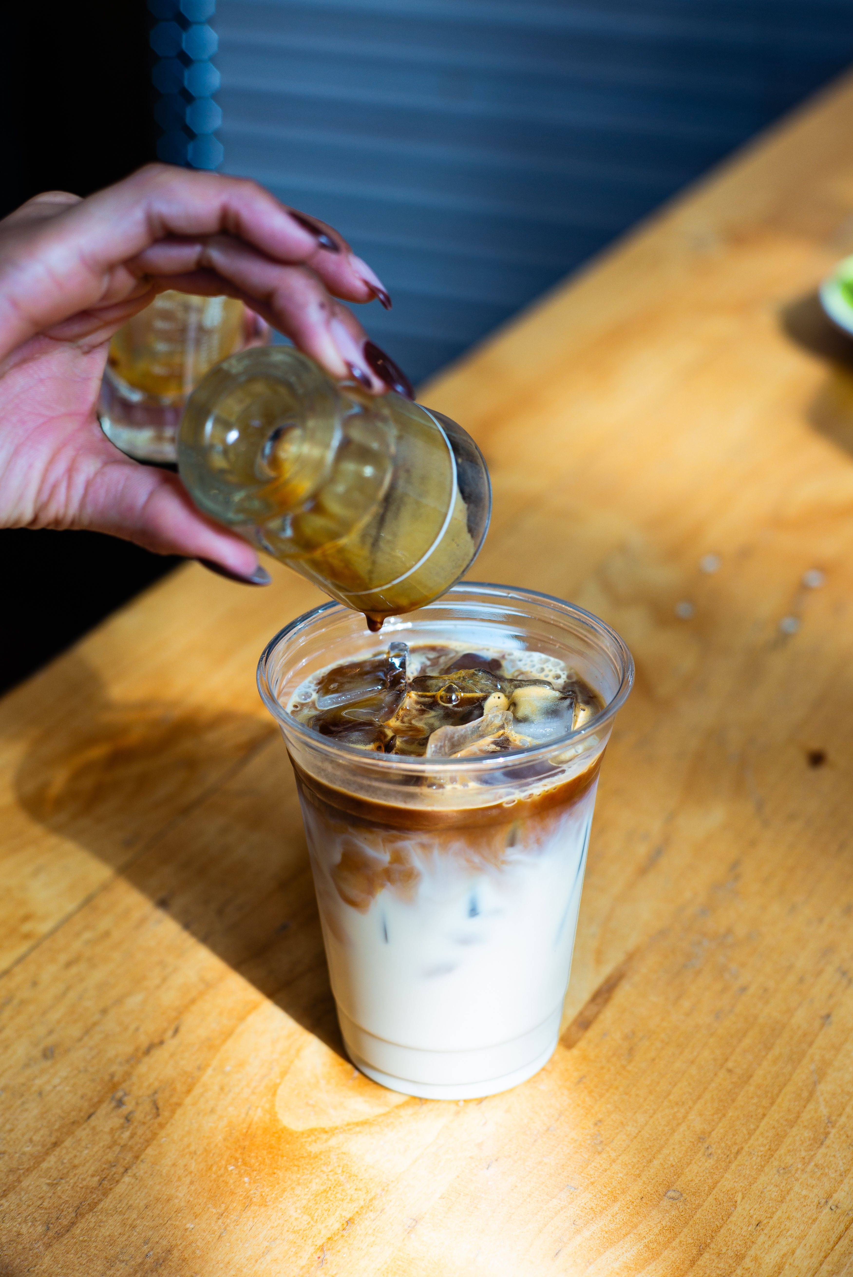 Refreshing Iced Latte with Espresso Pour · Free Stock Photo