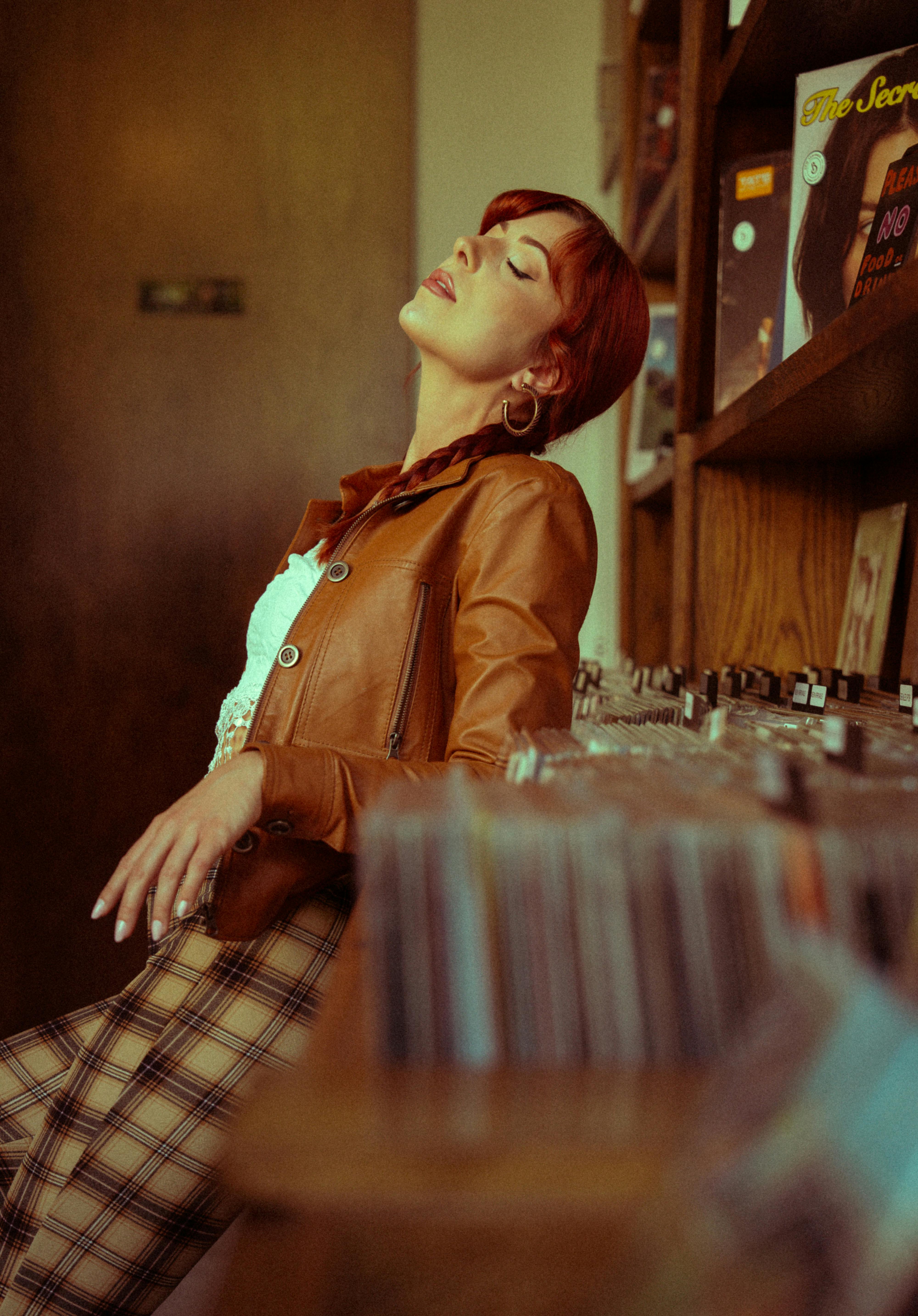 Retro Style Woman Relaxing in Record Store · Free Stock Photo