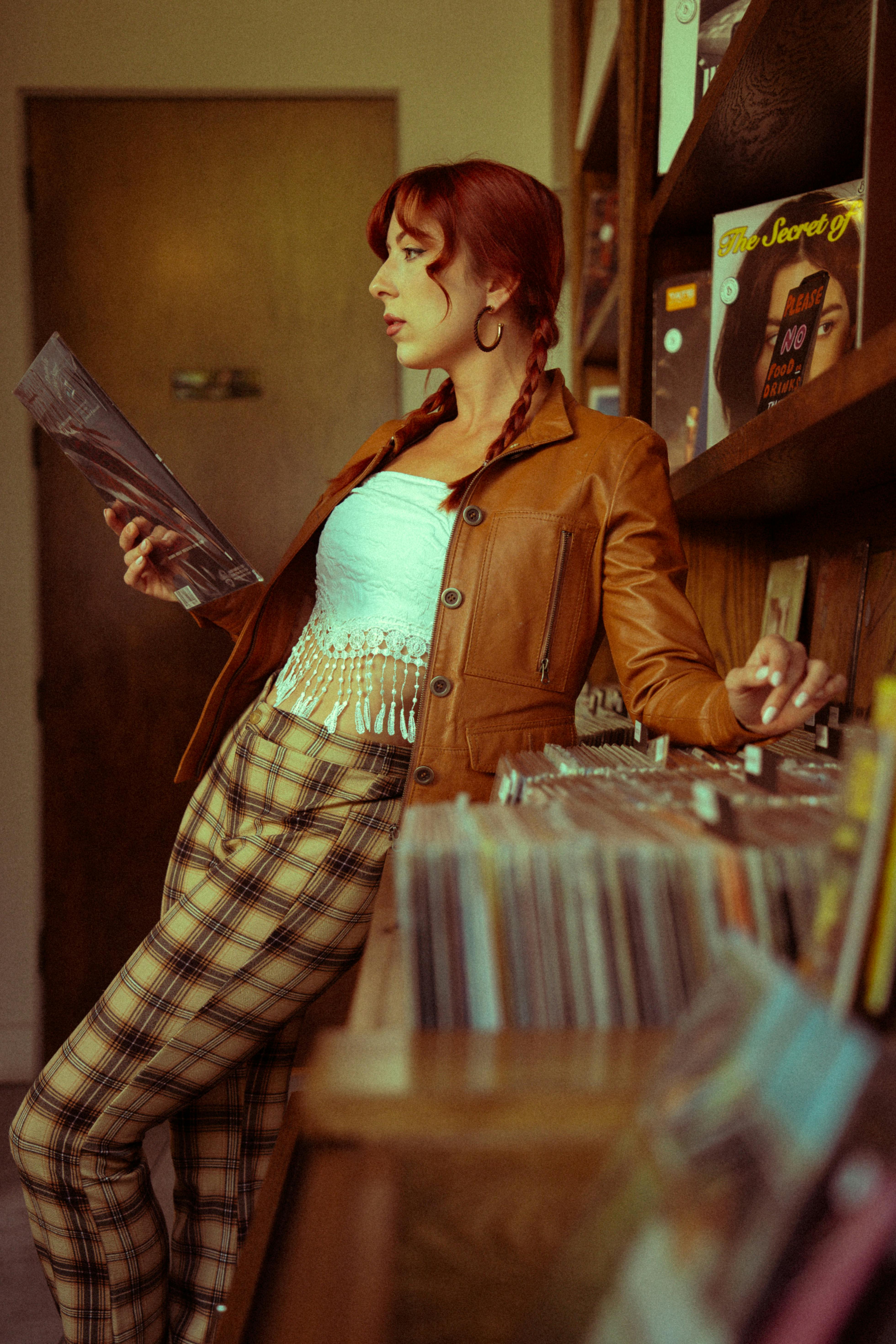 Retro Style Woman Relaxing in Record Store · Free Stock Photo