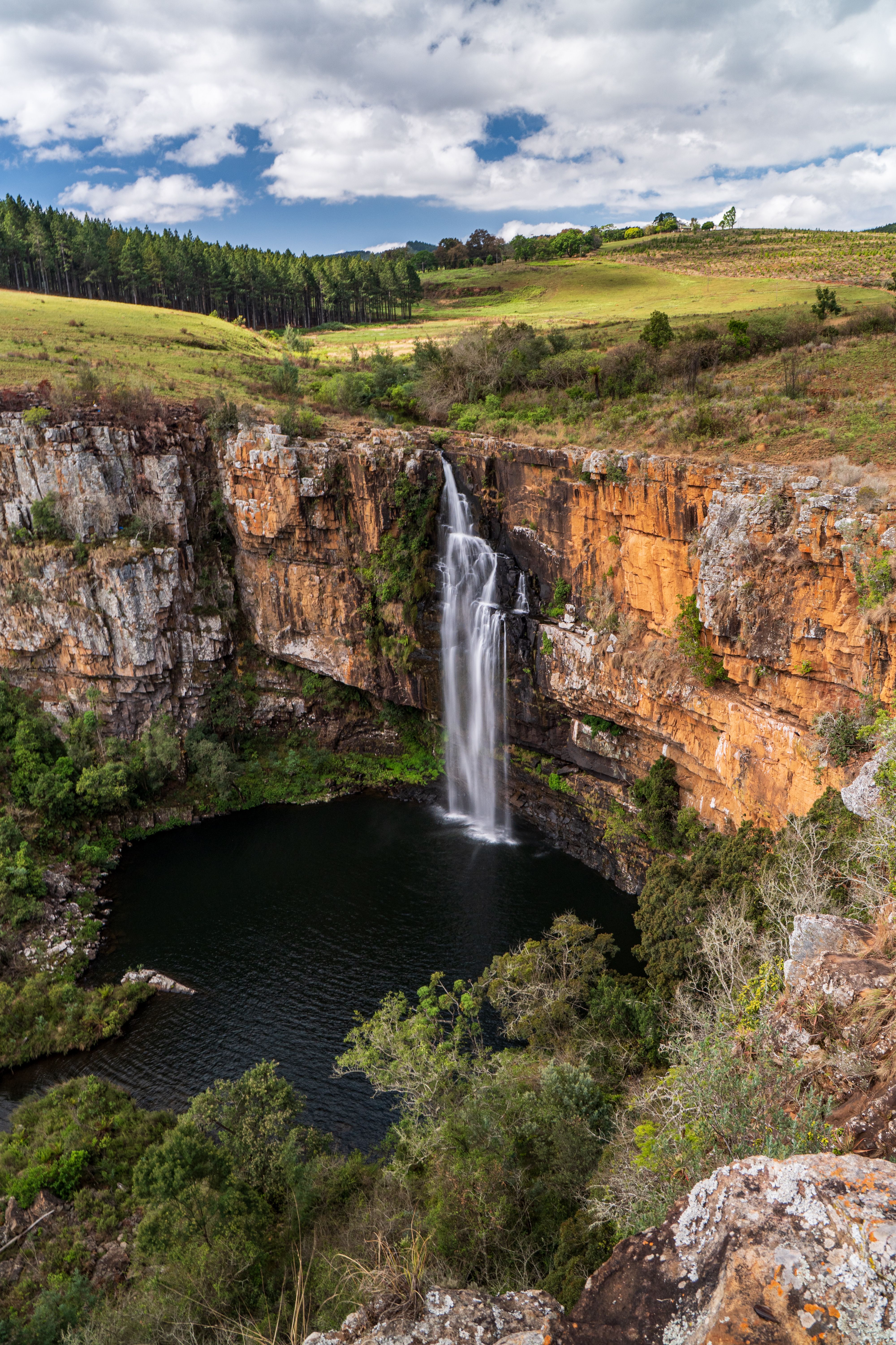 Majestic Waterfall Cascading Over Rocky Cliff · Free Stock Photo