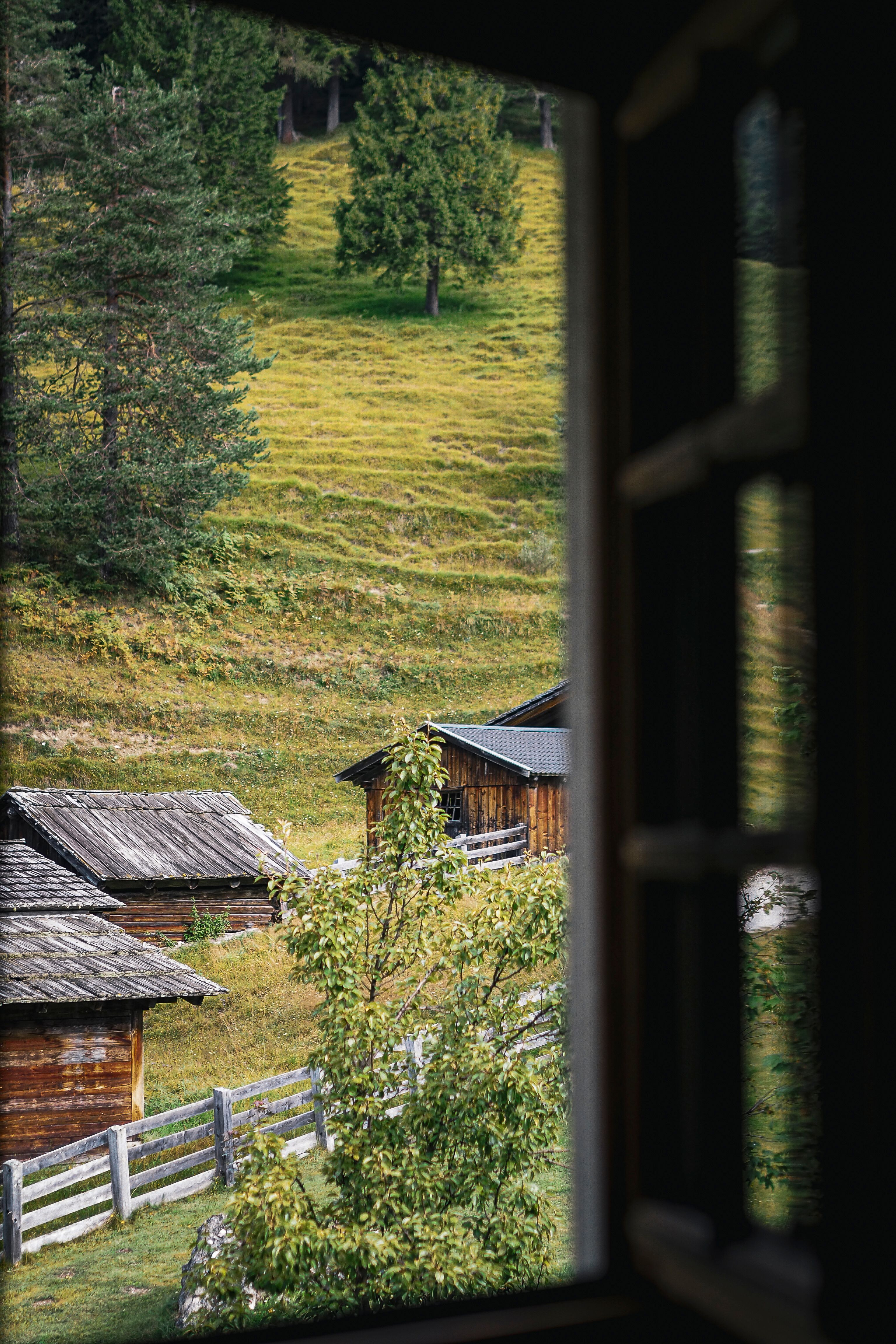 Charming Austrian Countryside View Through Window · Free Stock Photo