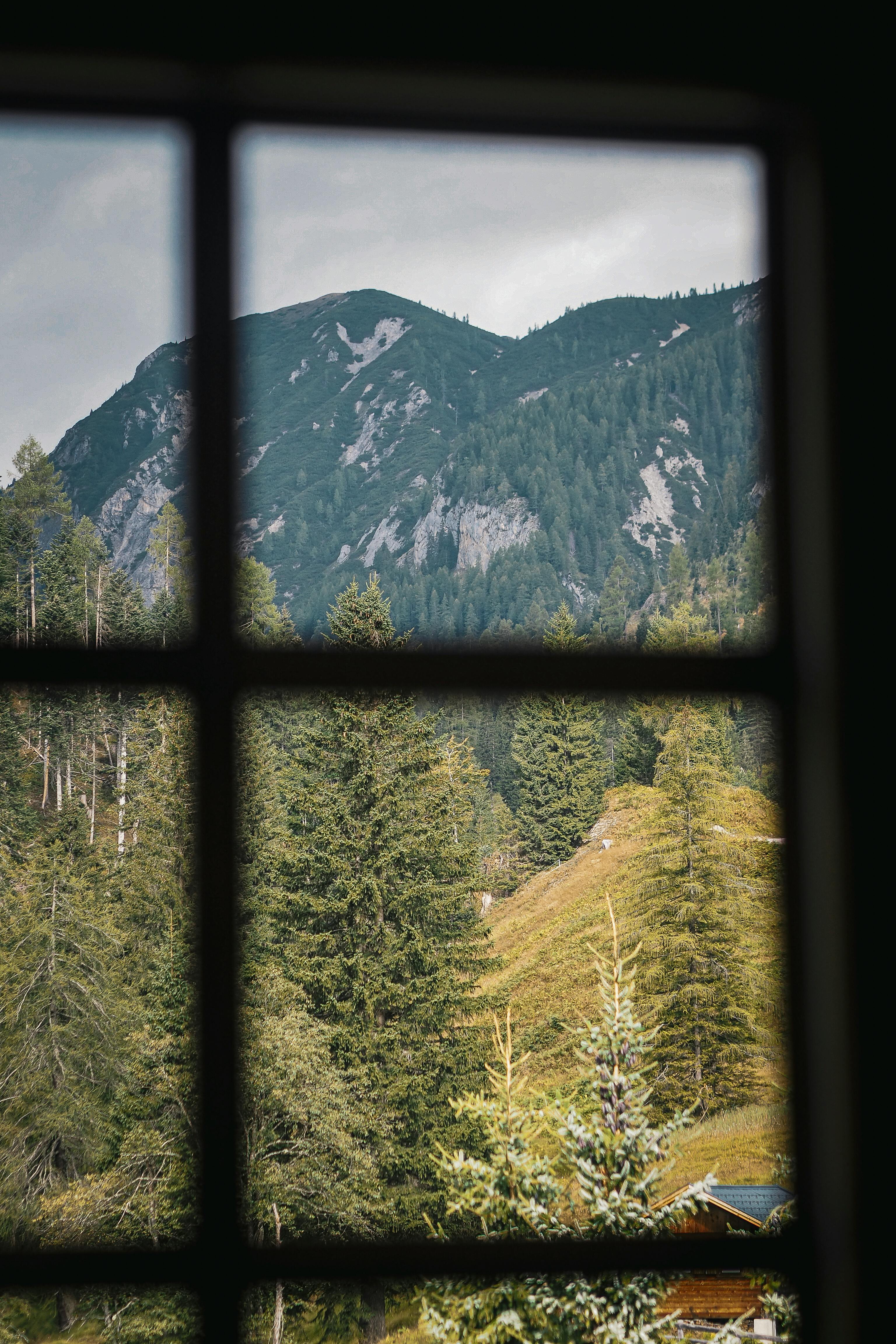 Scenic Austrian Alps from a Window View · Free Stock Photo