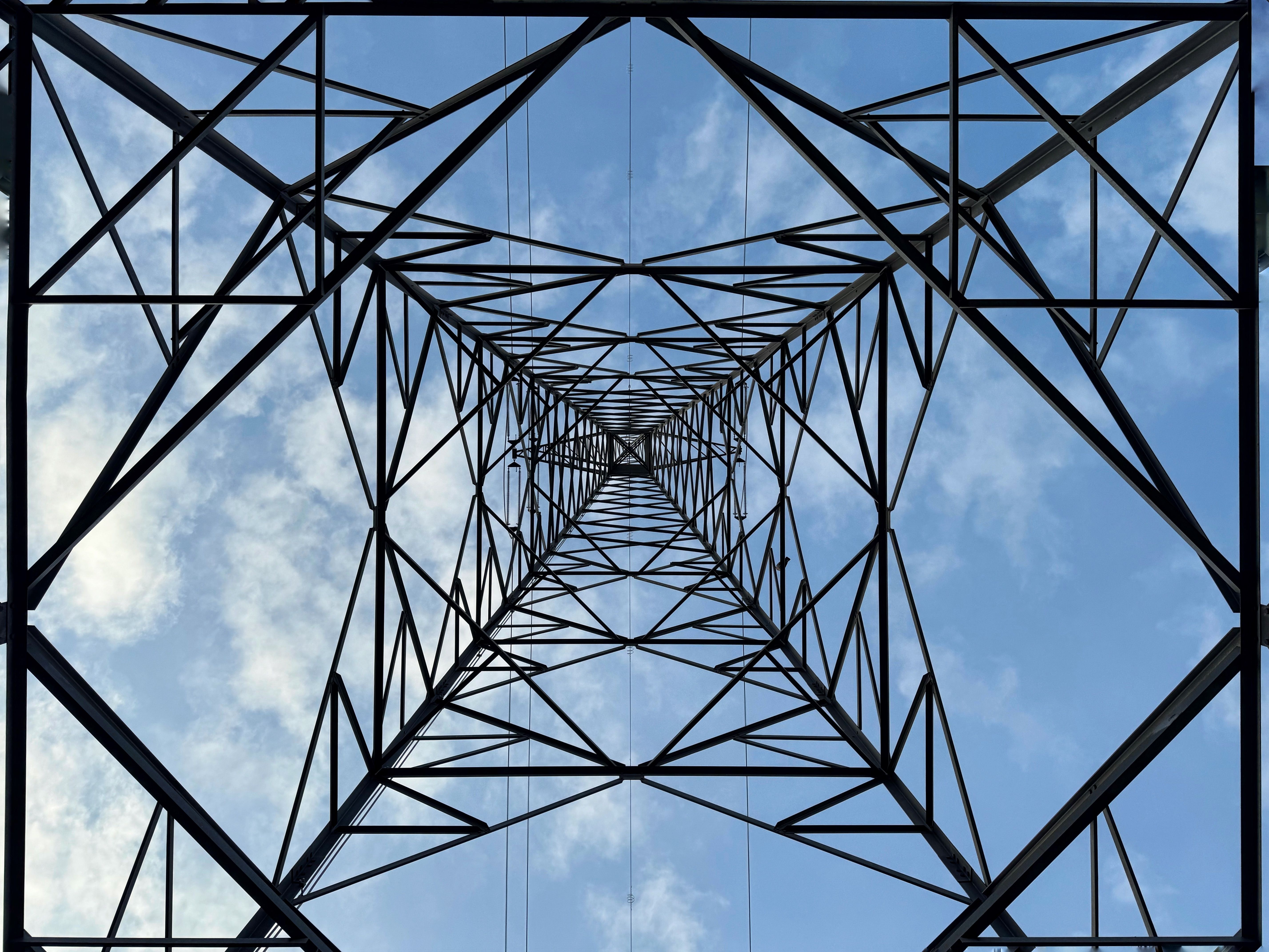 Symmetrical View of Transmission Tower from Below · Free Stock Photo