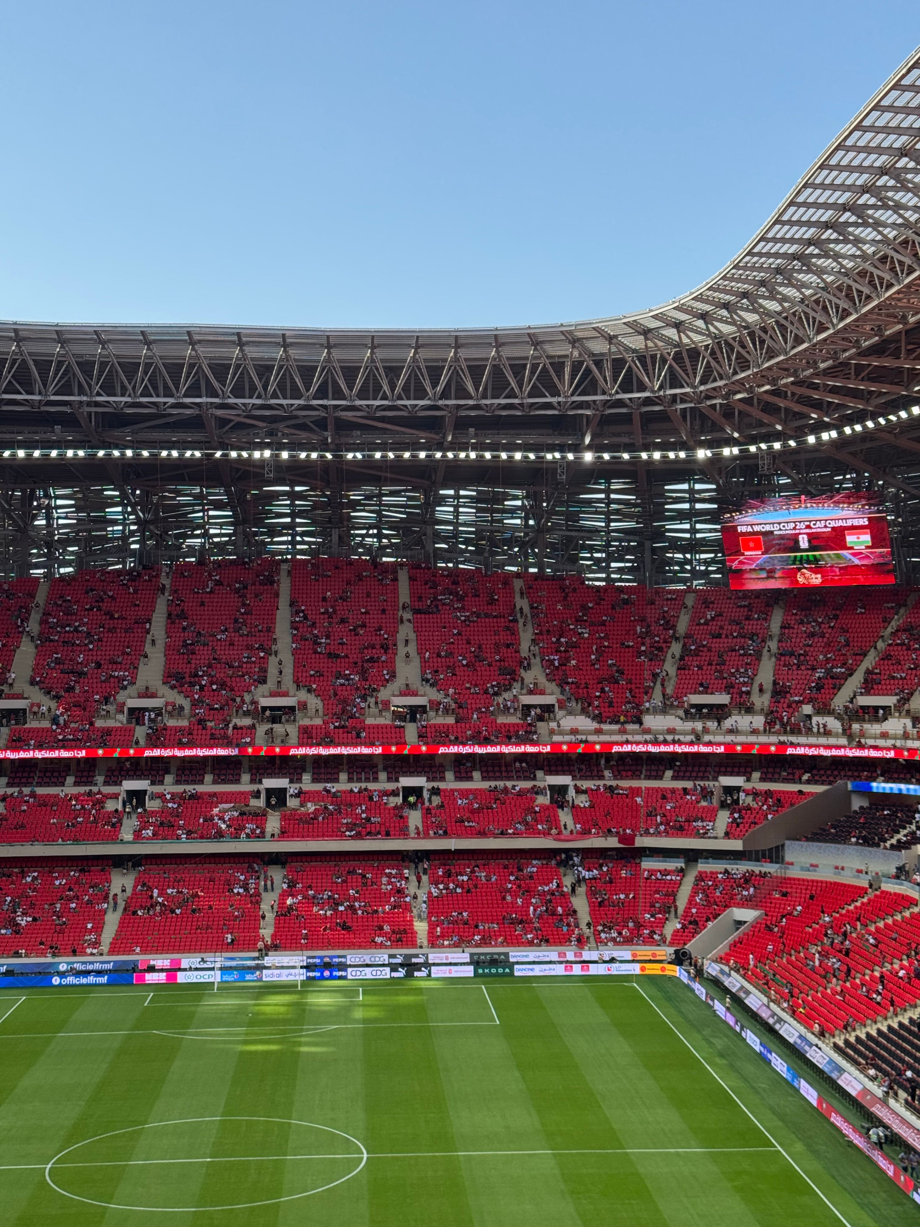 Vibrant Football Stadium with Spectators · Free Stock Photo
