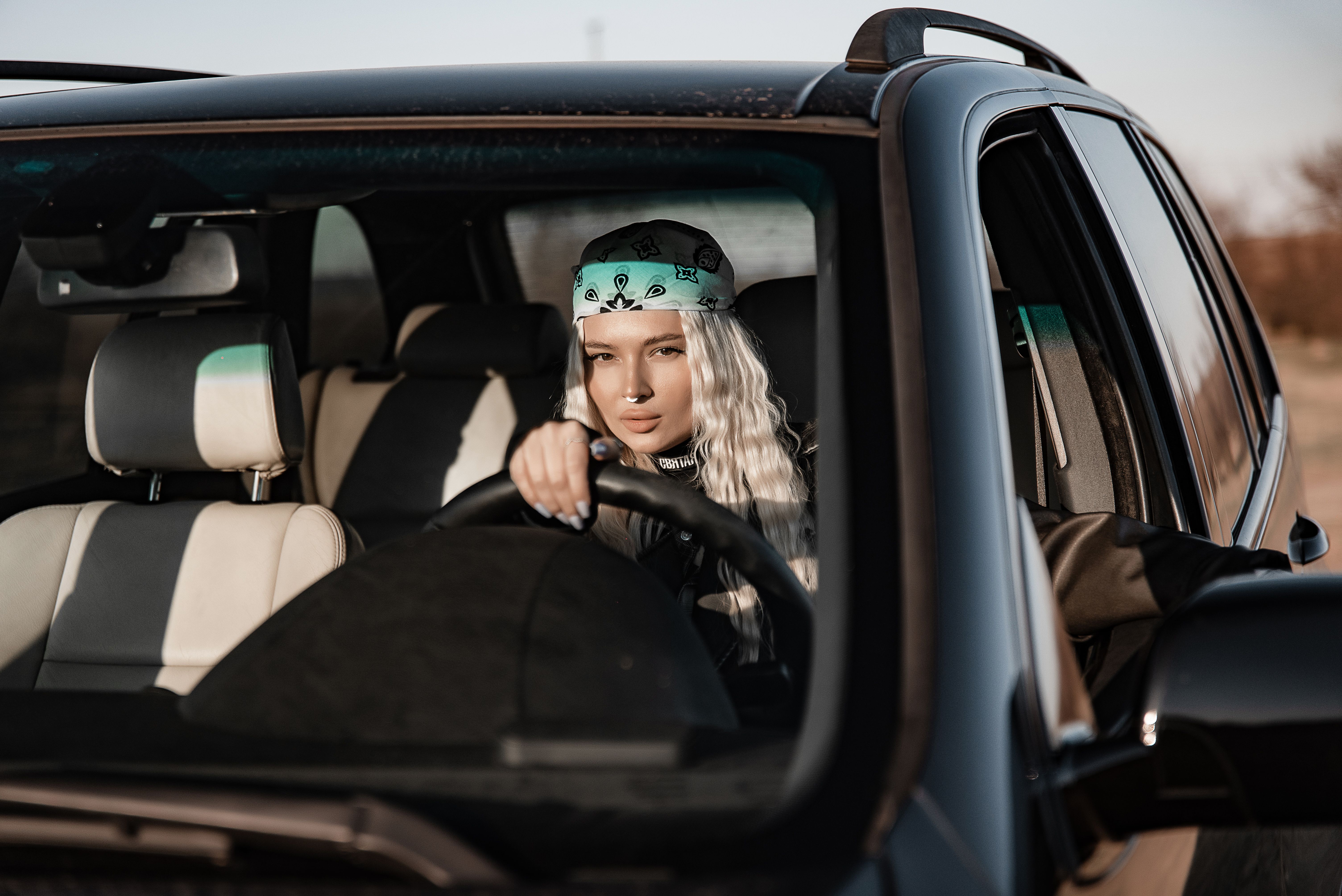 Woman Driving SUV with Focused Expression · Free Stock Photo