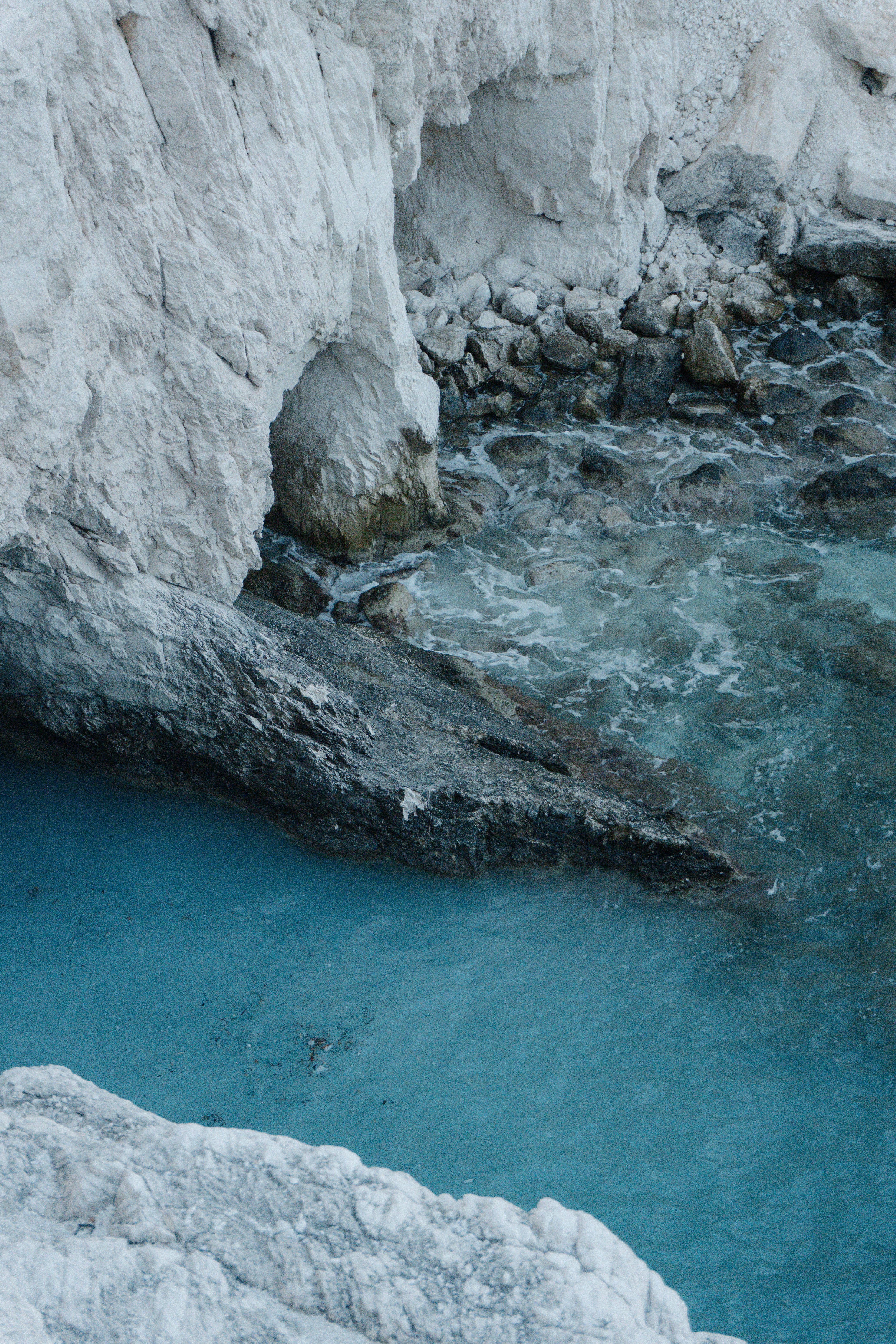 Crystal Blue Waters by Rugged Rocky Shore · Free Stock Photo