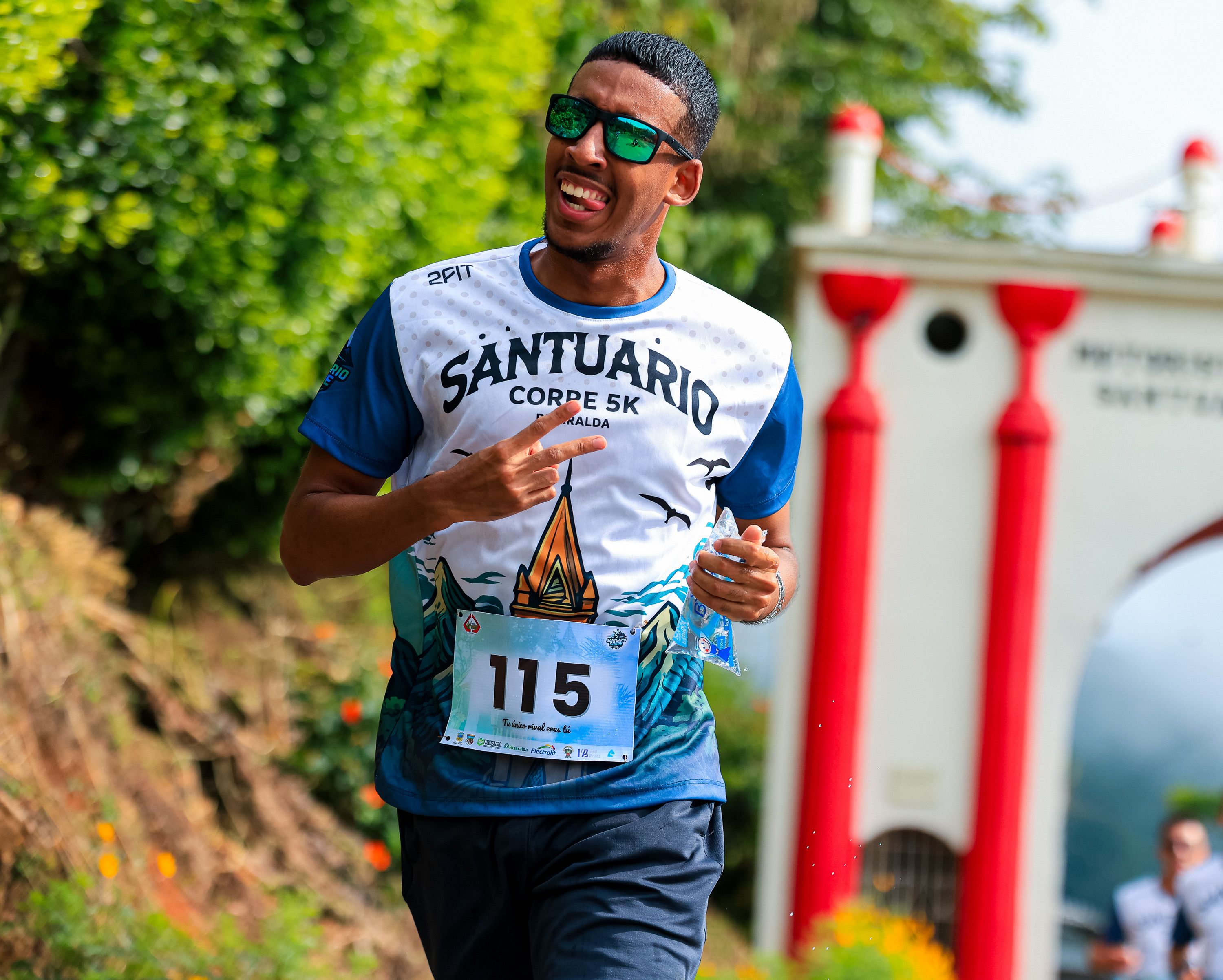 Energetic Runner Participating in 5K Race Outdoors · Free Stock Photo