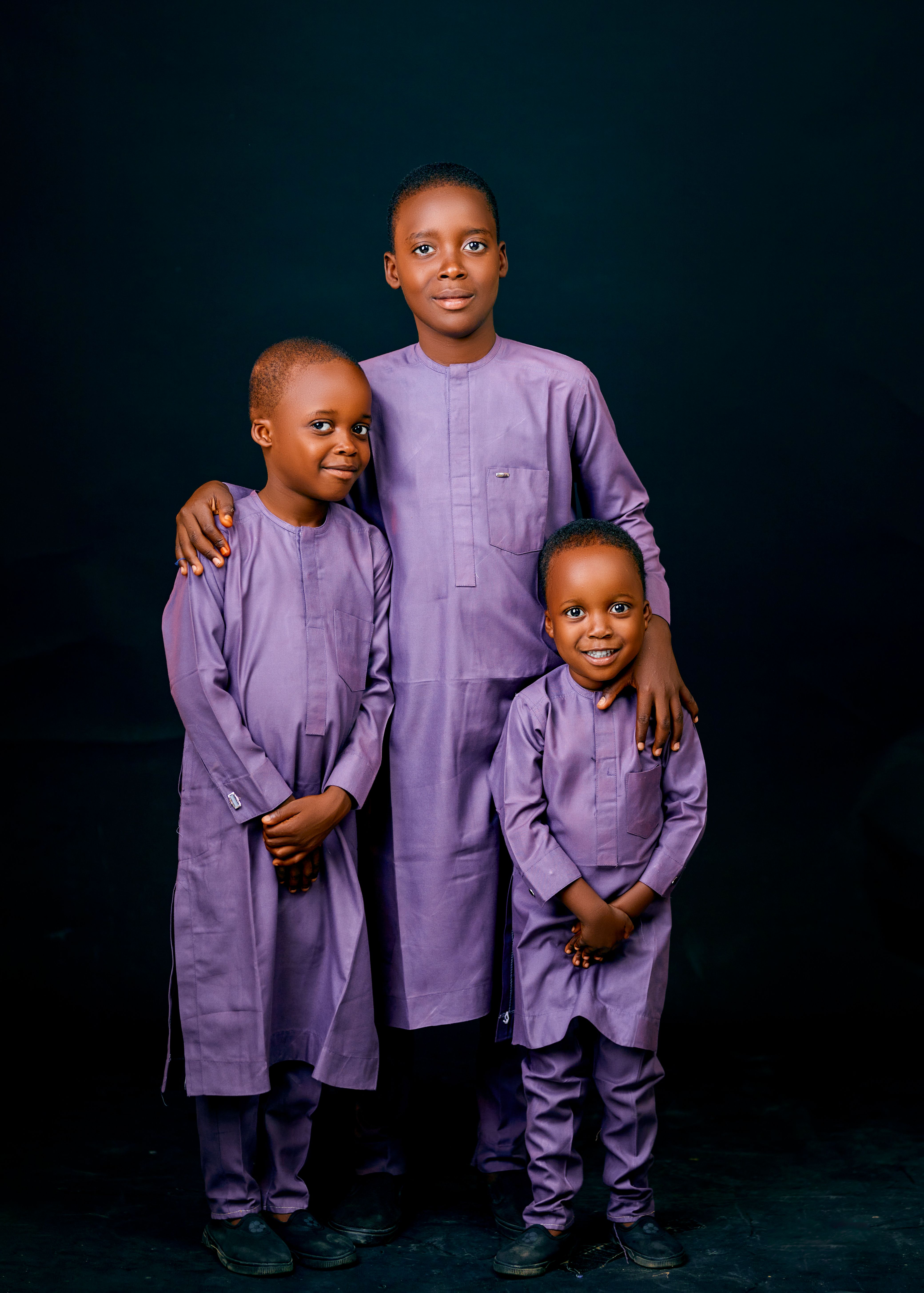 Portrait of Three Young Boys in Traditional Attire · Free Stock Photo